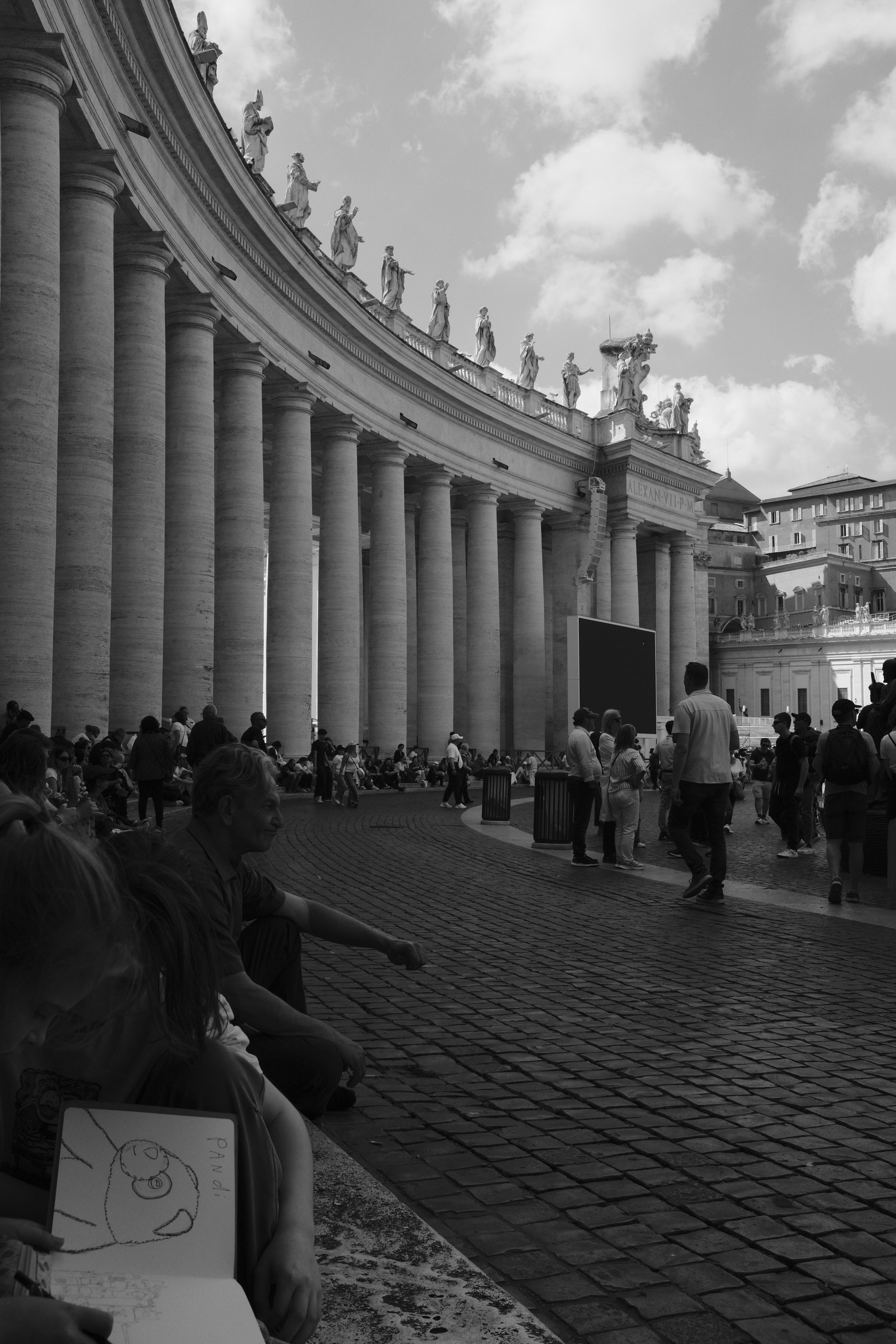 Courtyard of Columns: Crowds and Shadows under the Arch