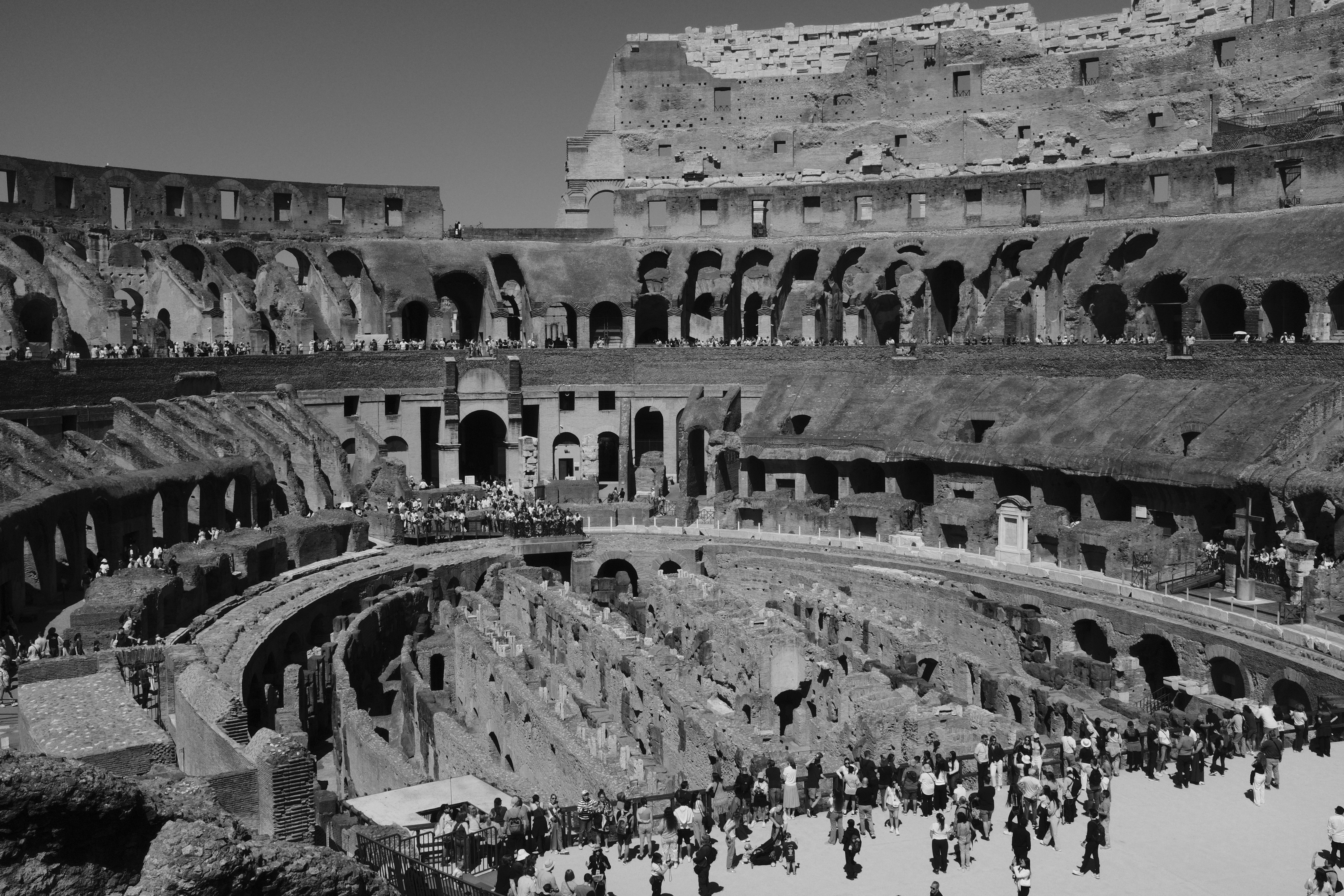 Echoes of the Coliseum: A Crowd Beneath Ancient Arches