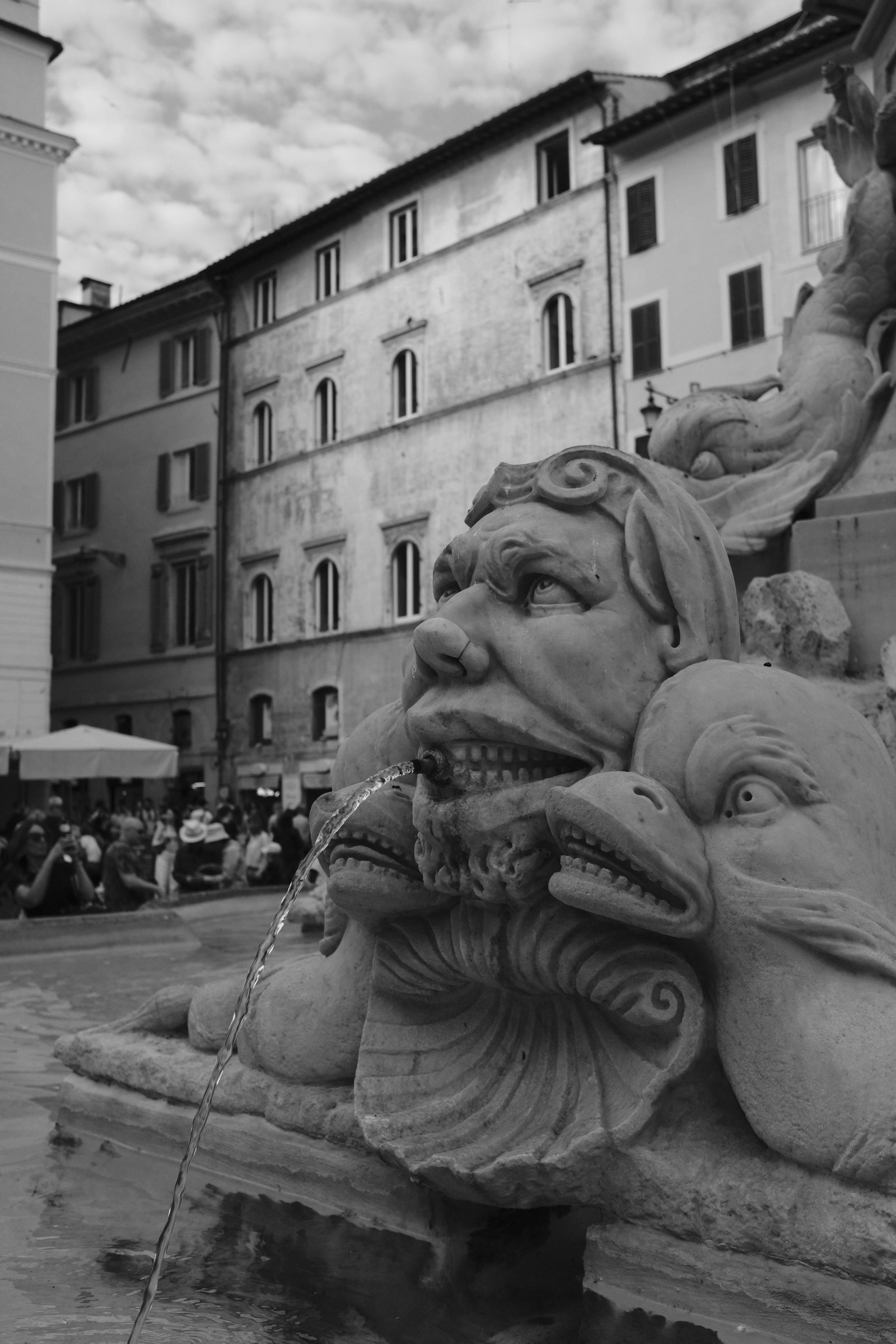 Stone Faces, Flowing Water: The Carved Fountain in a Tuscan-inspired Square
