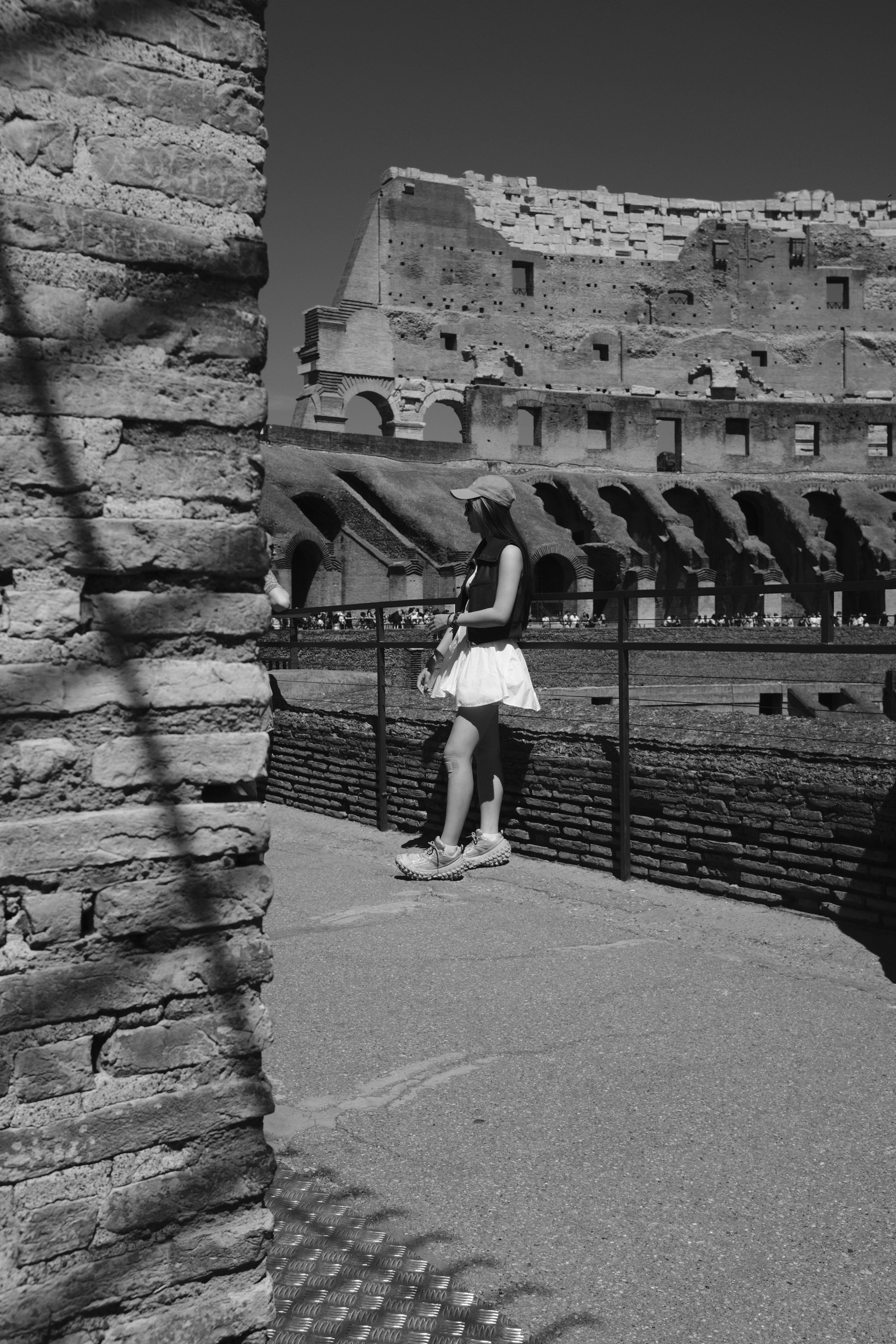 Coliseum Echo: A Shaded Moment Along the Ancient Wall