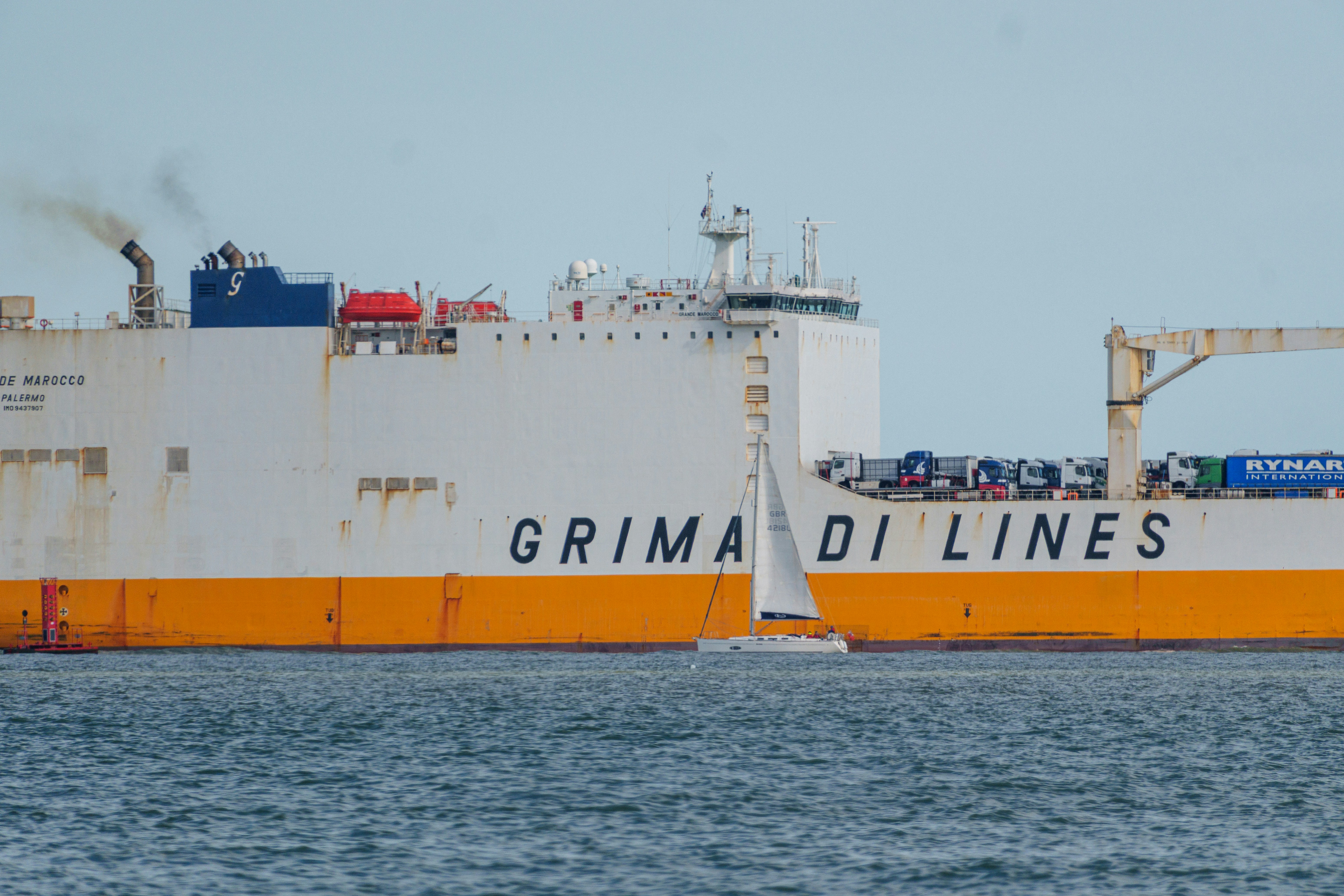 Grime and Hull: A Coastal Freighter at Distant Wake