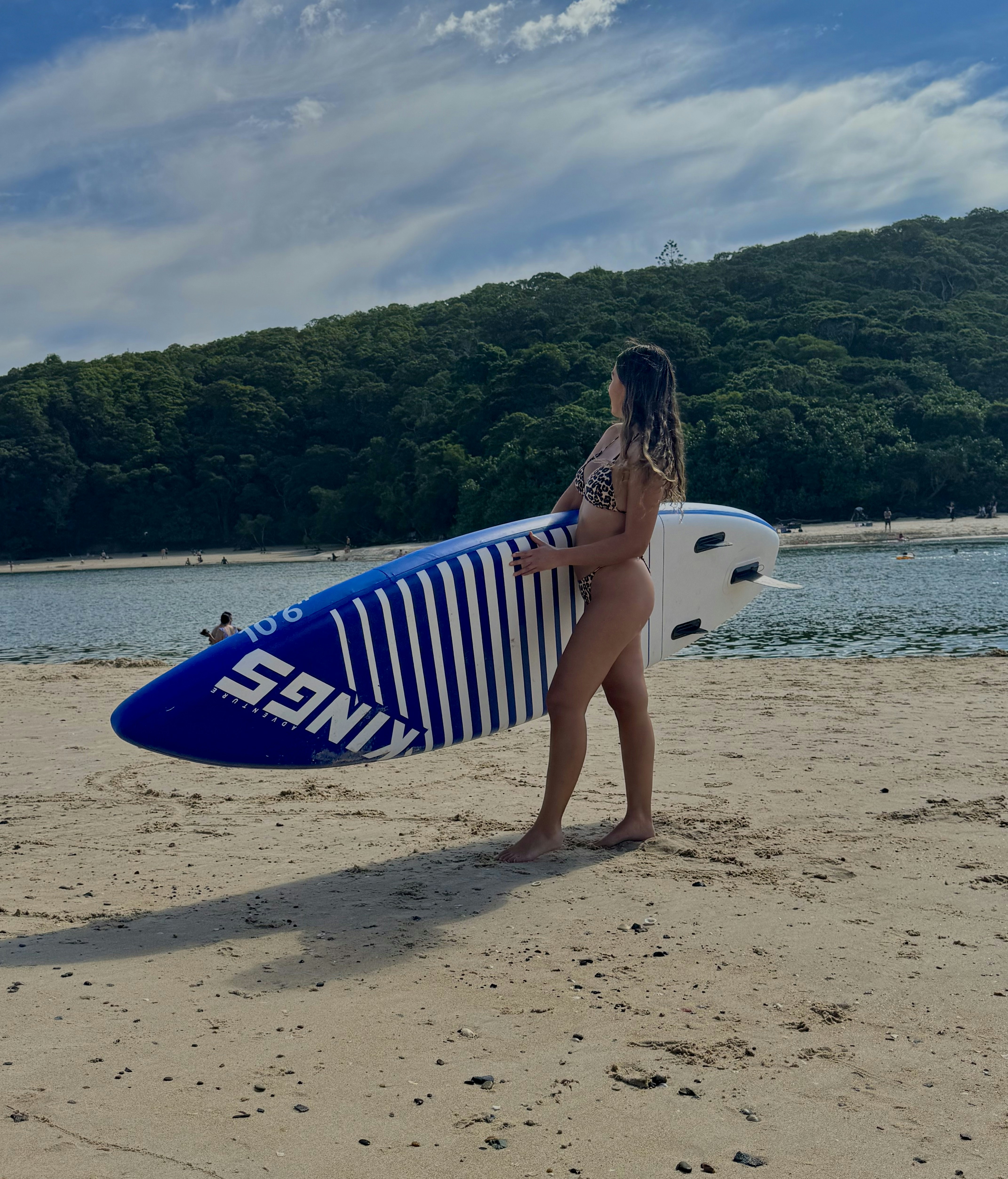 Surfboard at the Shore: A Solo Moment on Sunny Sands