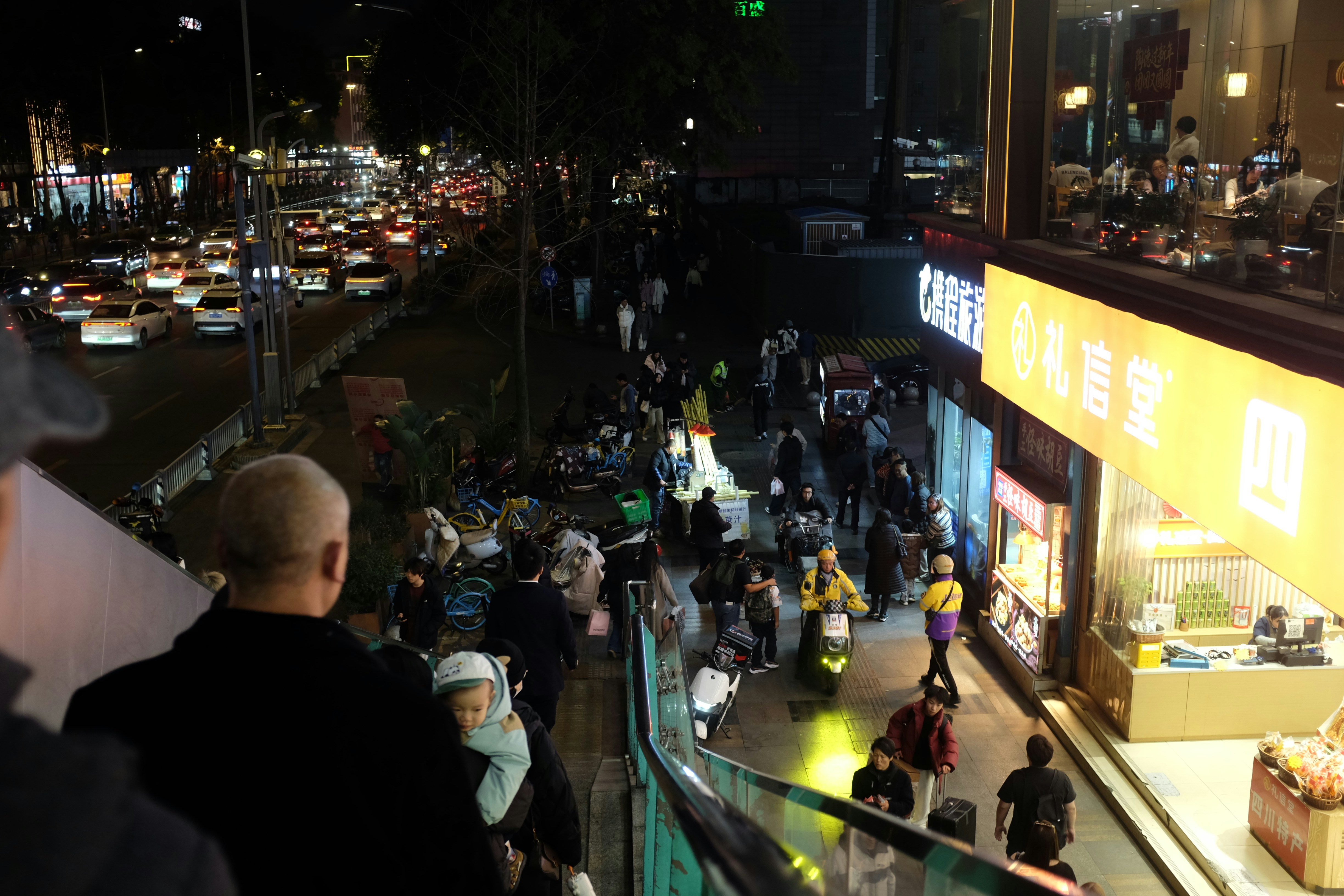 Night Market Ascent: Descending Escalator Through a Neon-Lloyed Street
