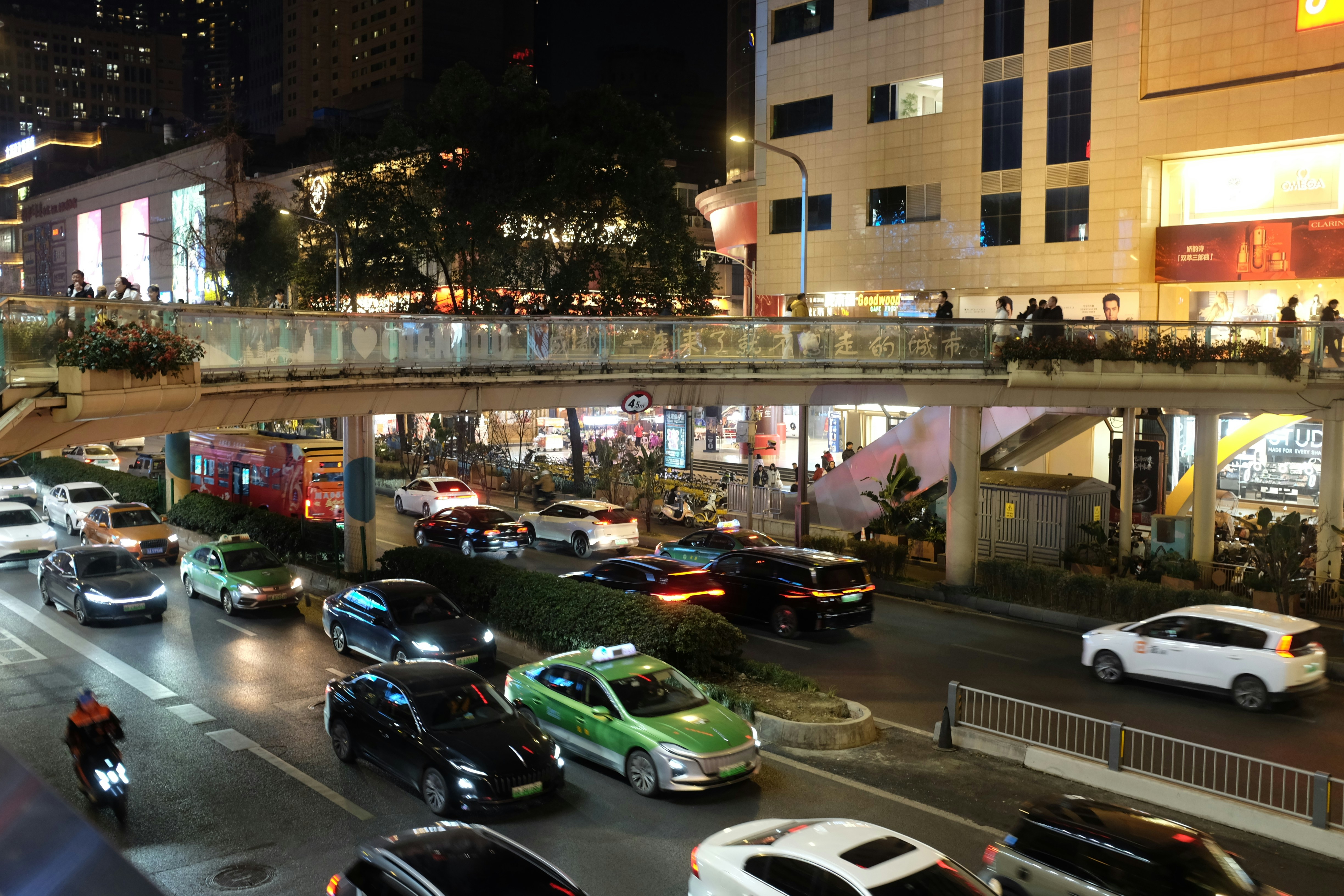 Neon Rush Overhead: A Busy City Street at Night