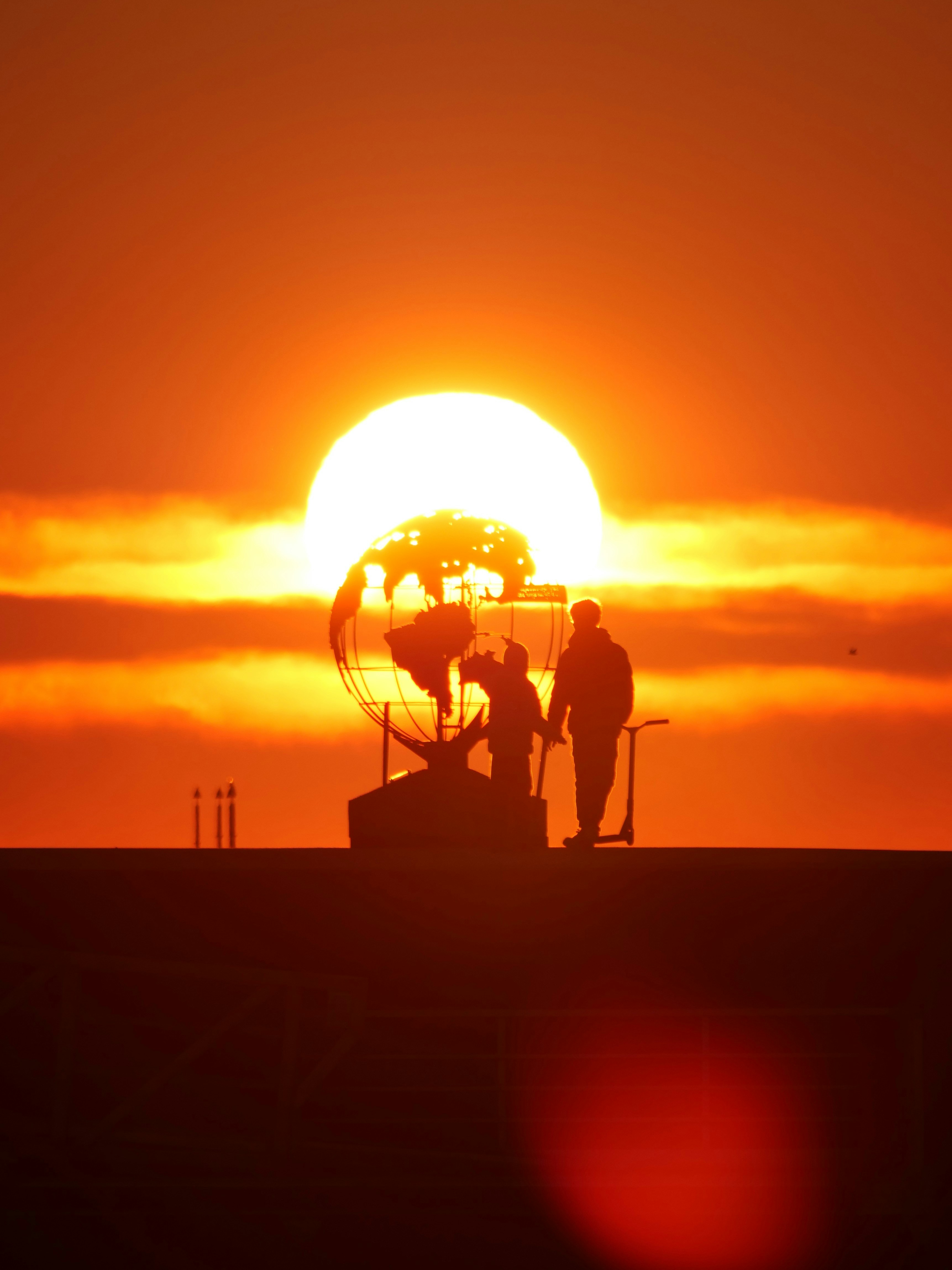 Sunrise on the Helipad: Silhouettes at the Edge of Dawn