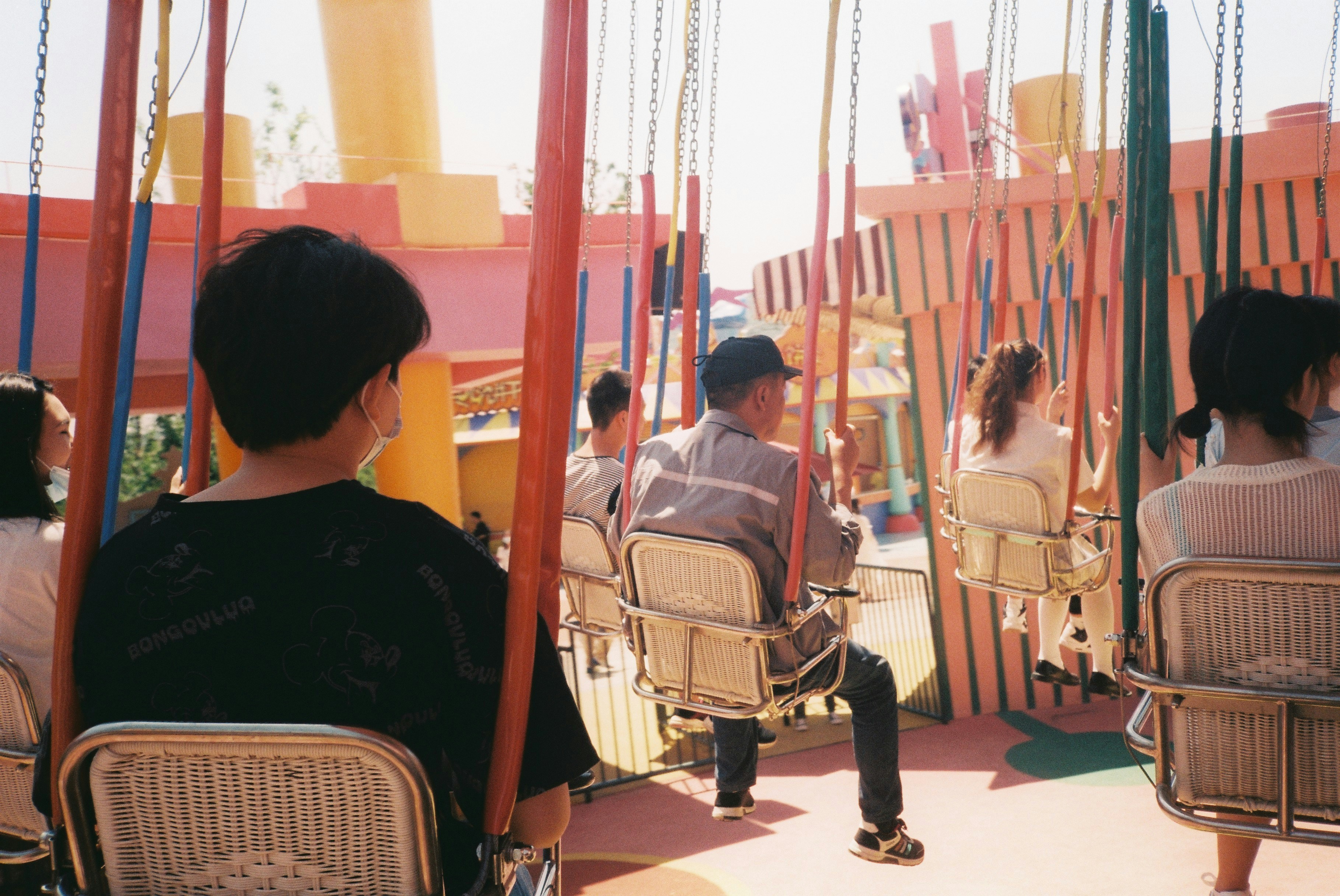 Swing Set Portrait: Quiet Crowd on a Sunny Ride