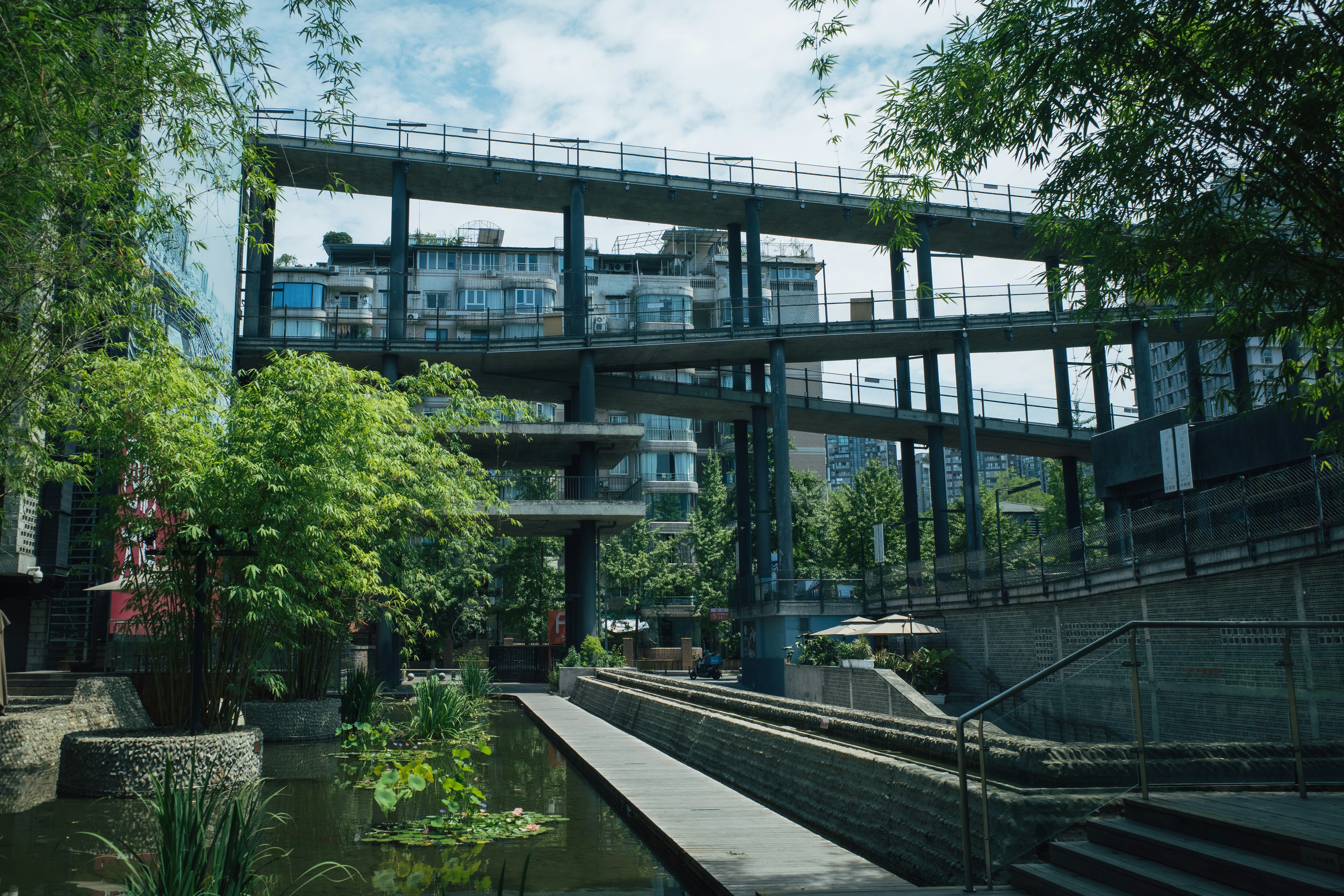 Urban Skywalk: Concrete Bridges Above a Tranquil Canal