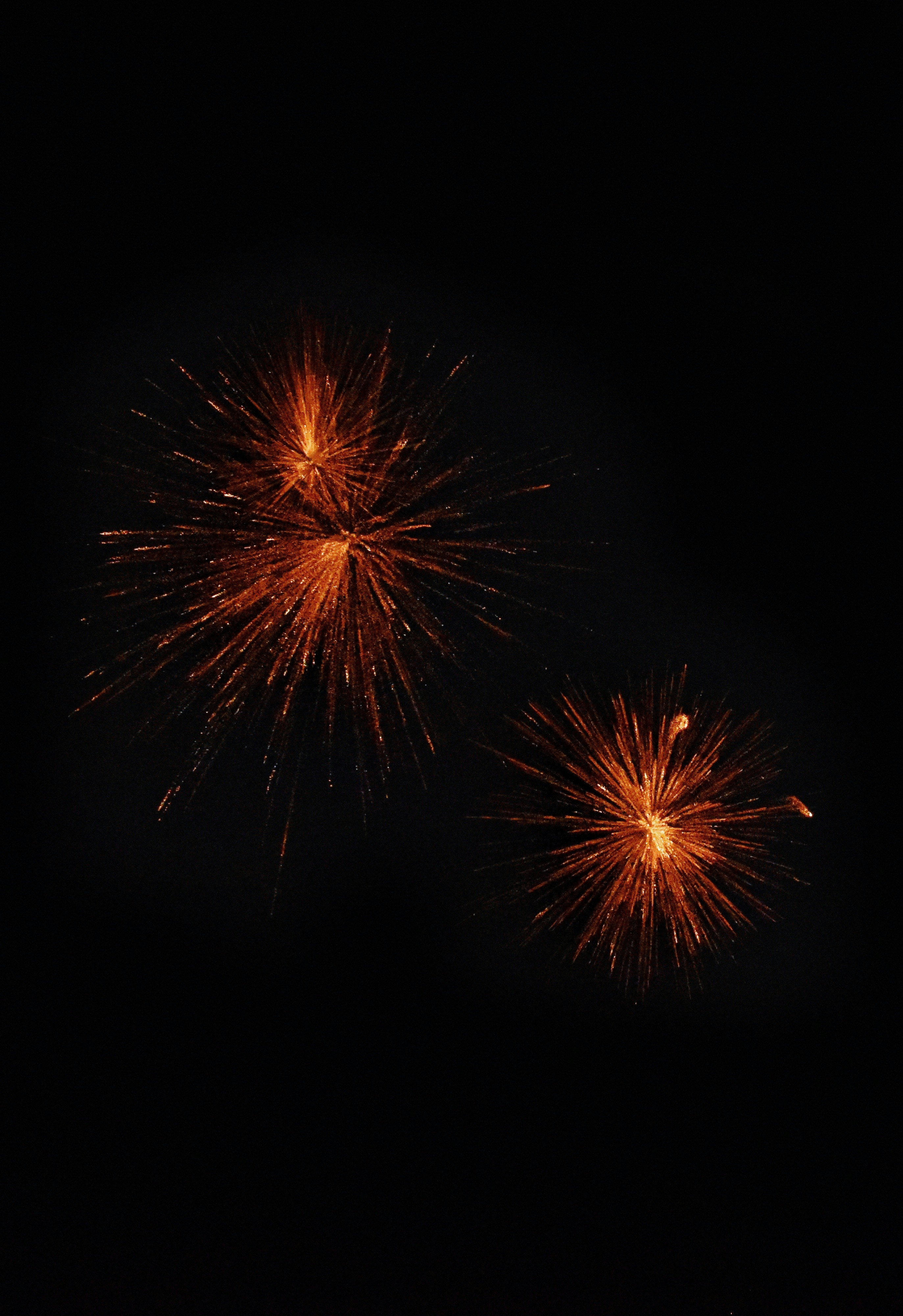 Dual Ember Orbs: Firework Crescendos Across Night Velvet