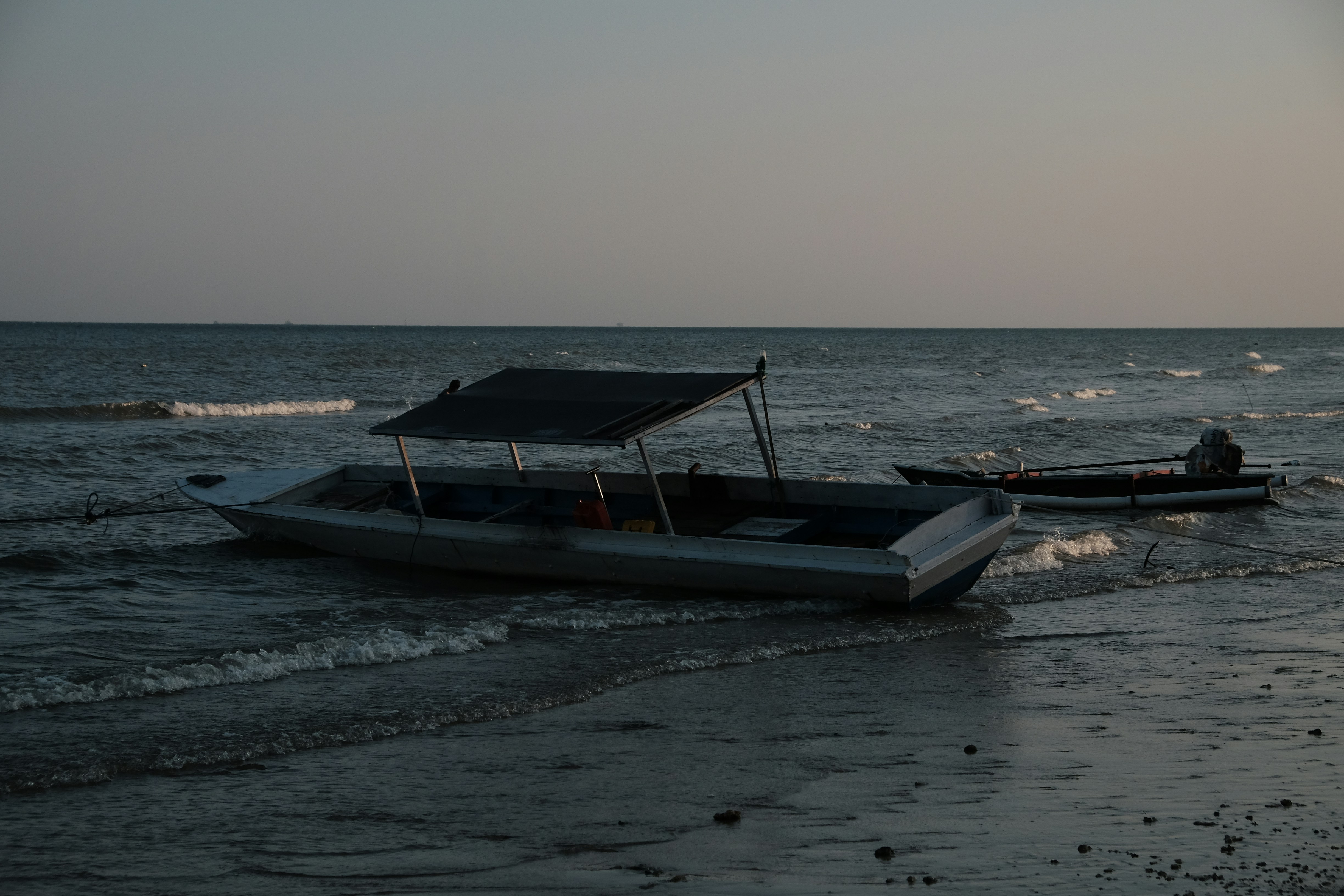 Boat at Dusk: A Quiet Seaplane of the Shoreline