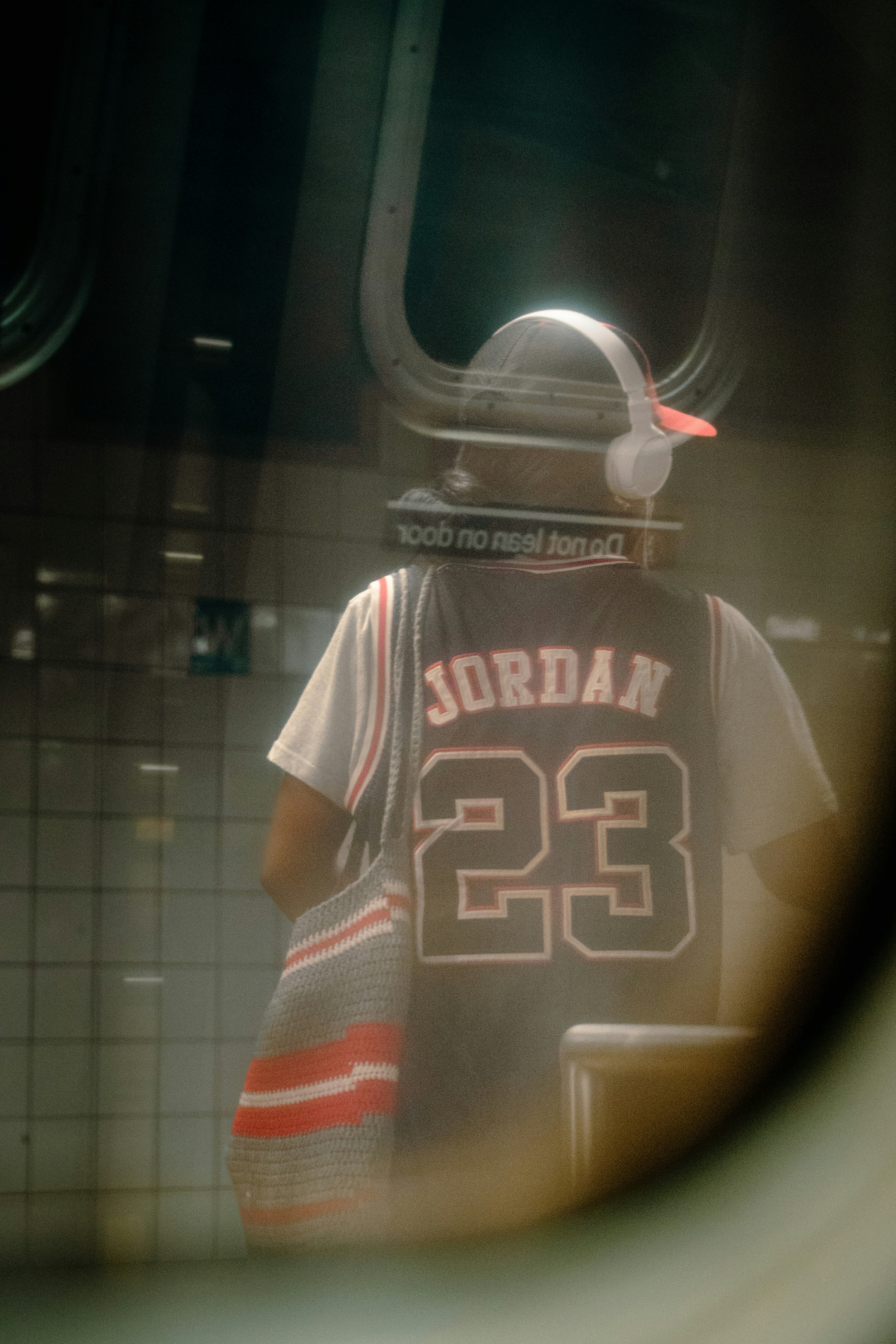 Back in the Game: Jordan 23 Portrait through a Round Window