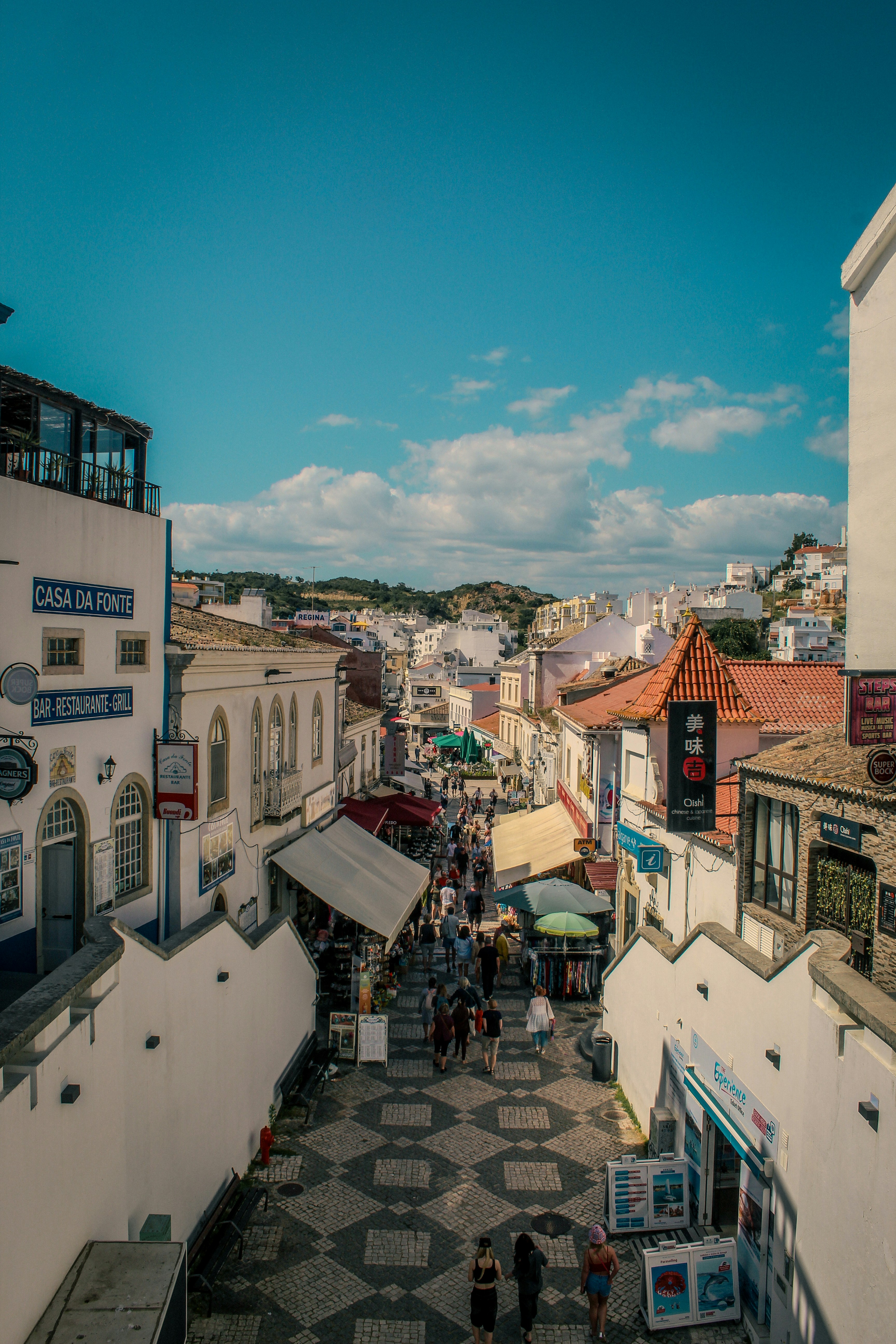 Sunlit Calle Della Vista: A Mediterranean Market Walk Down a Stony Street