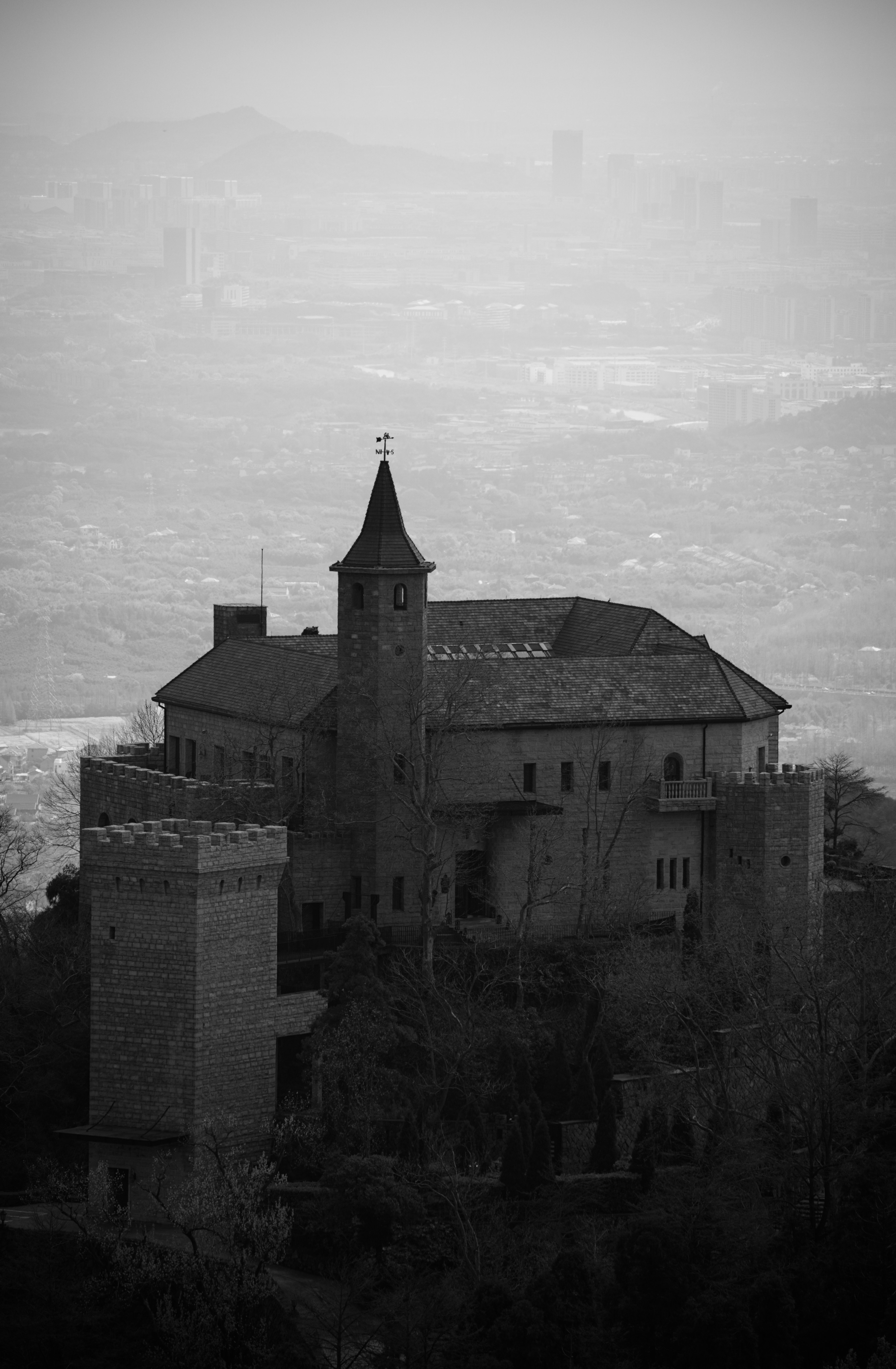 Castle silhouette: a quiet sentinel above a misty valley
