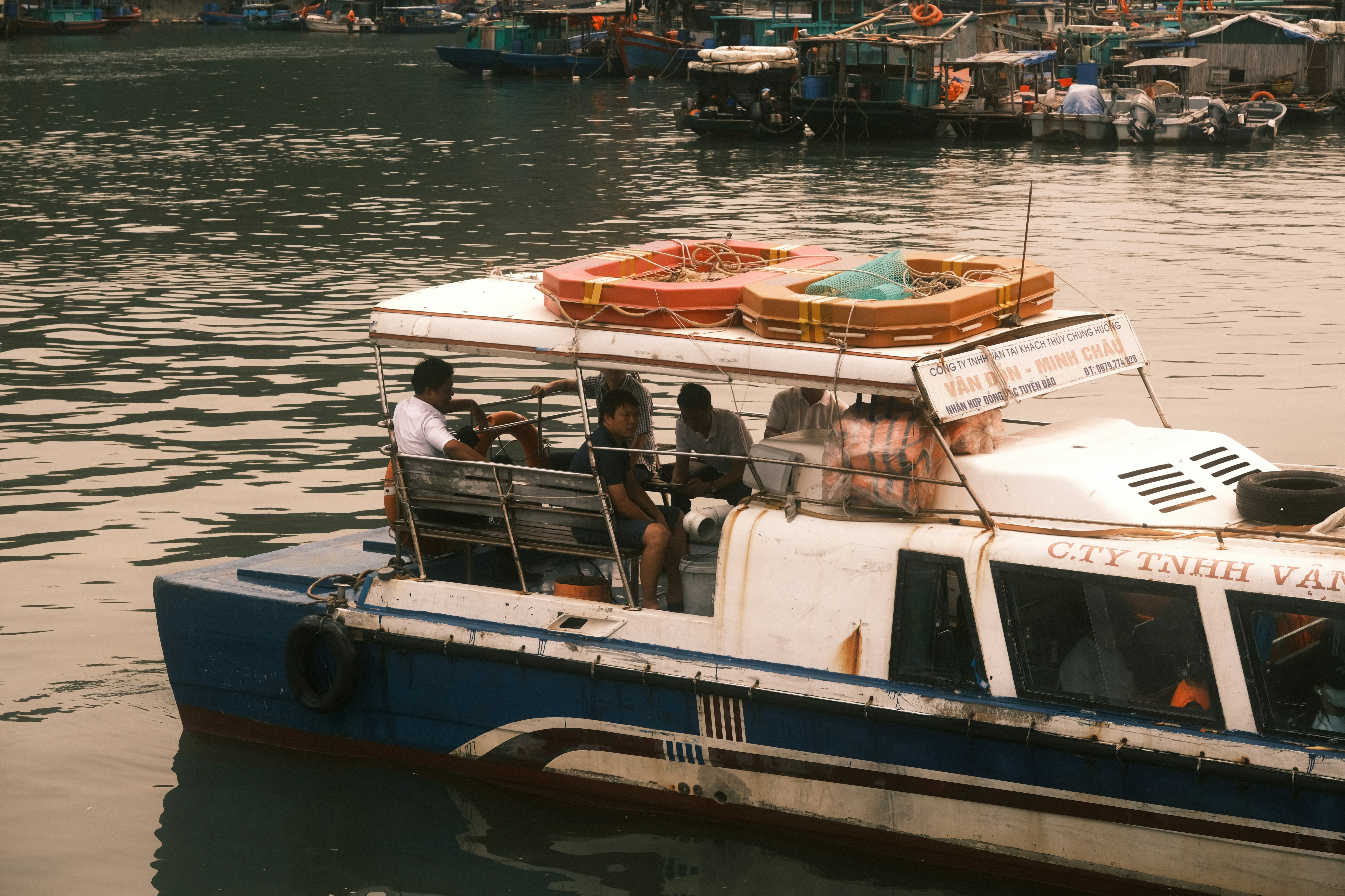 Passengers on a Lively Waterfront Tour Boat