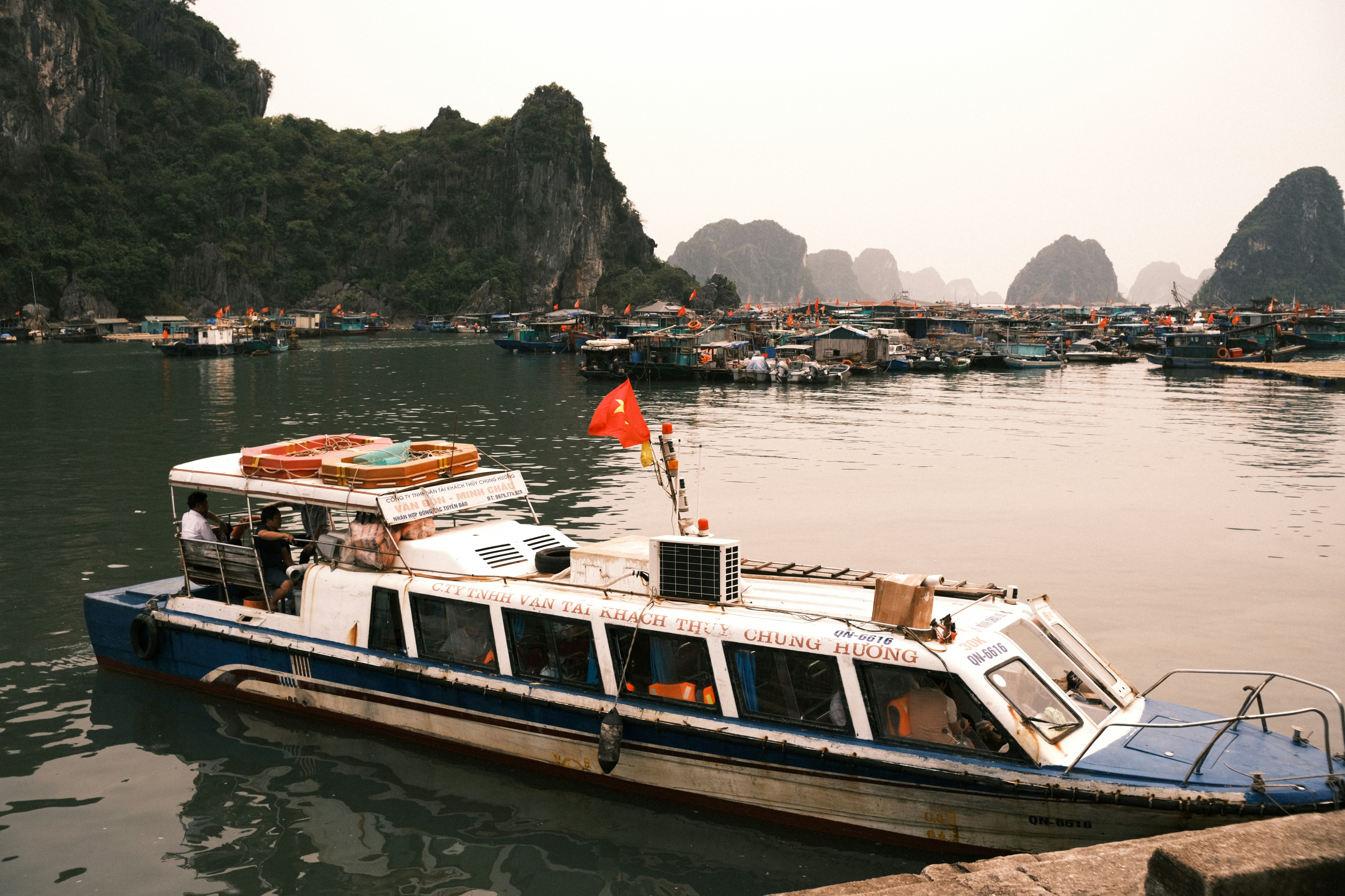 Harbor Vessel at Dawn: A Fleet of Limestone Islets in Quiet Water