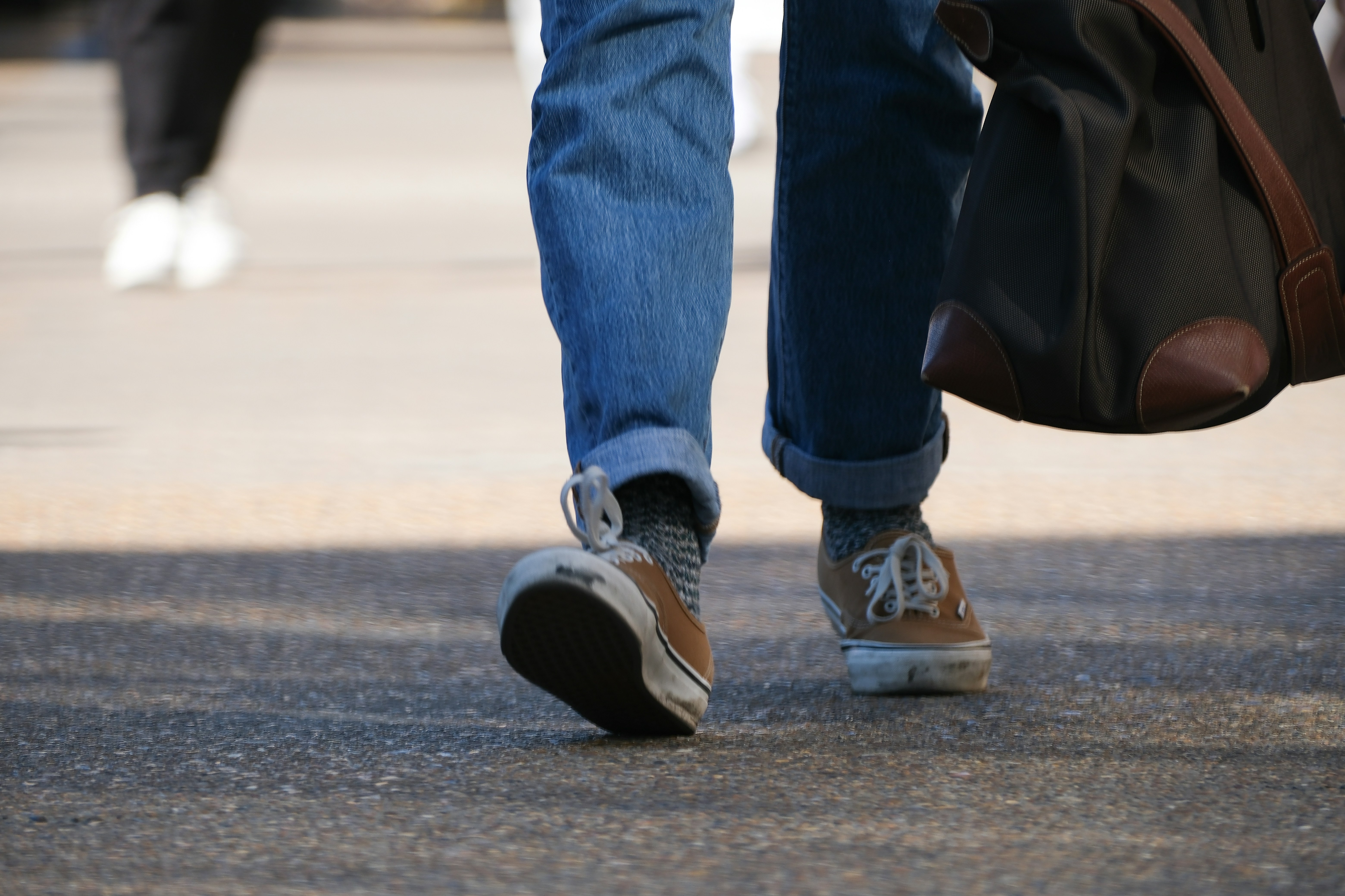 Close-up of Casual Solestep as Two Pairs Walk Onward