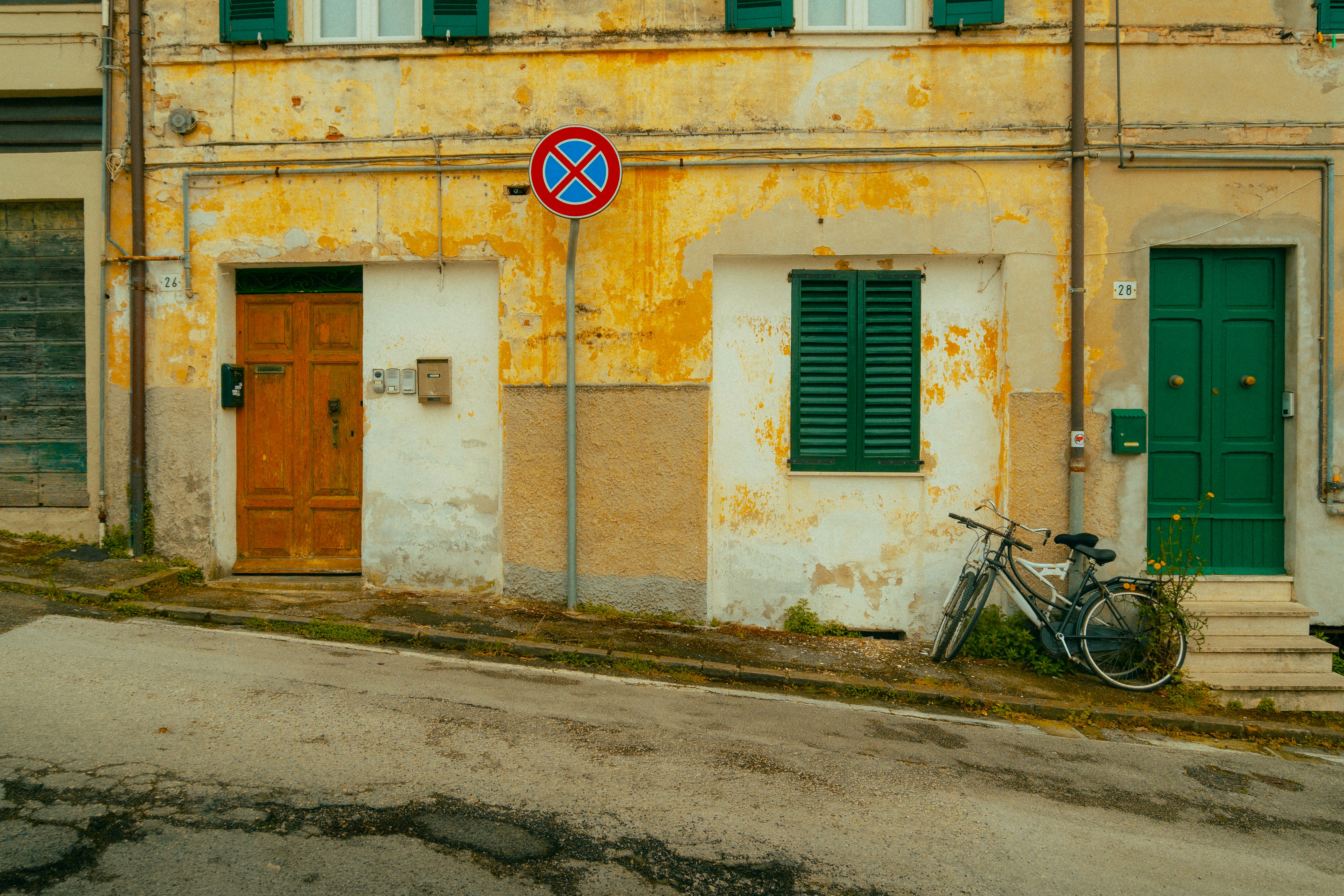Weathered Facade and Quiet Street: A Street-Level Portrait