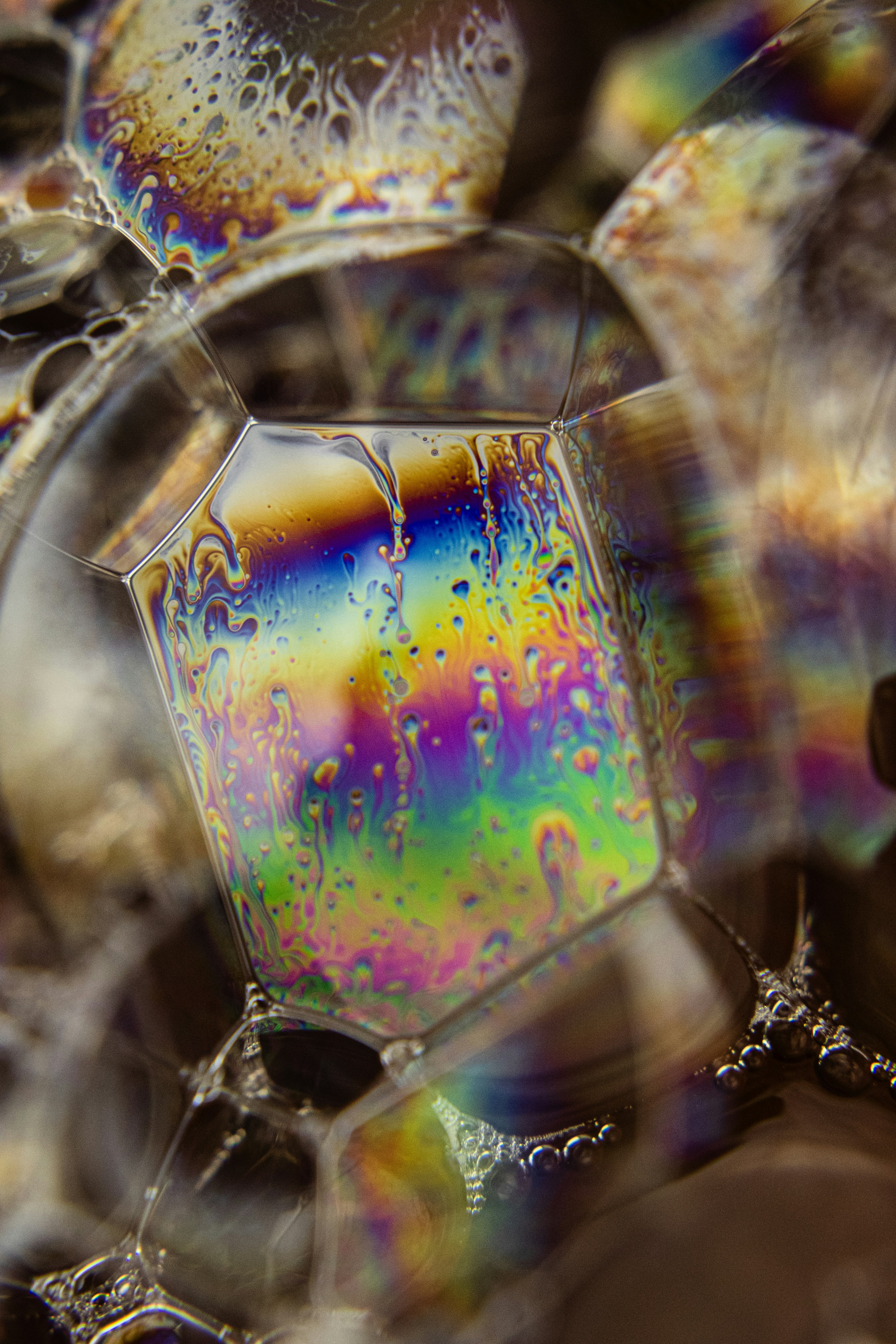Iridescent Facets: A Macro Mosaic of Bubble Glass and Light