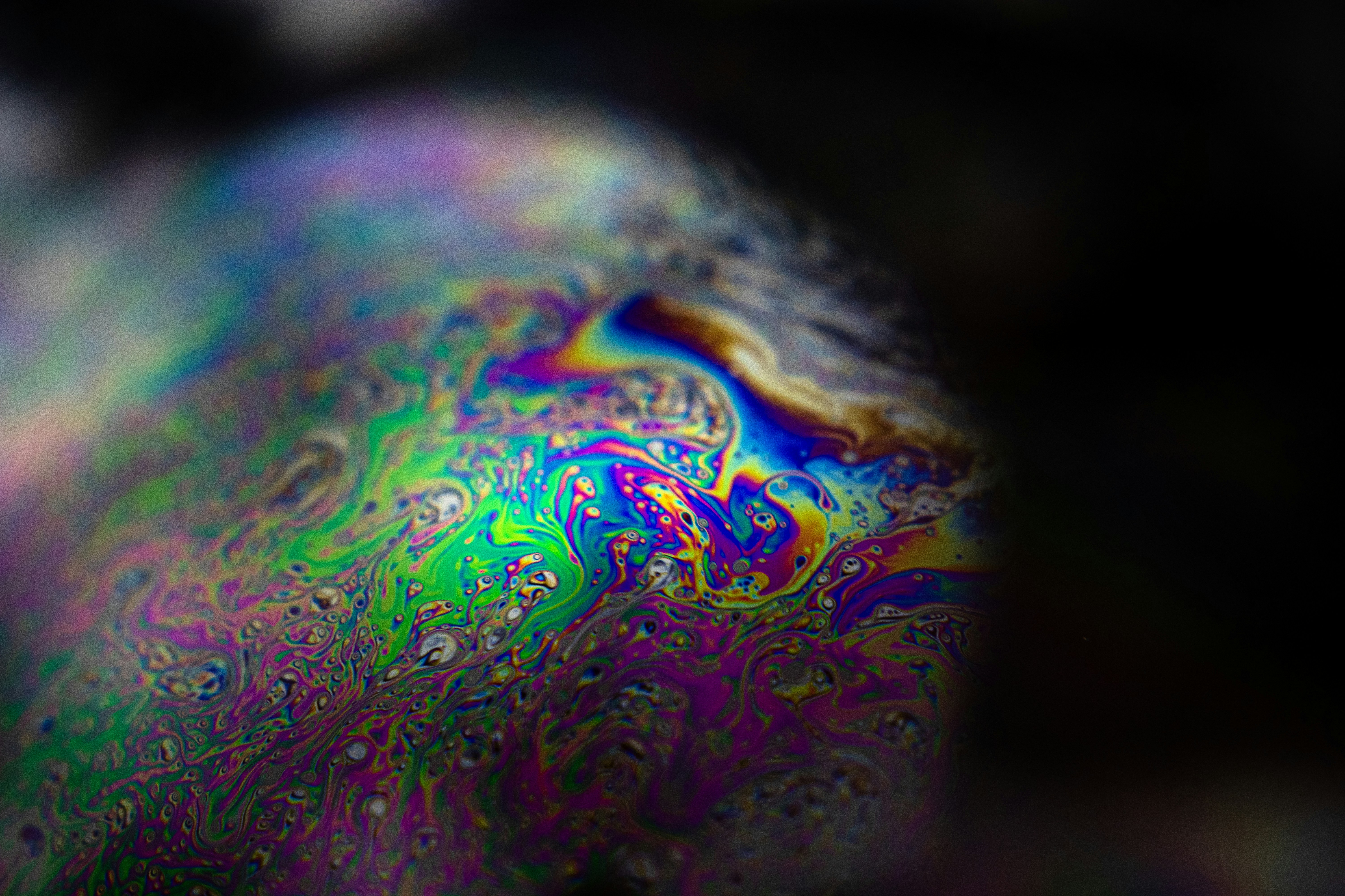 Iridescent Chaos: A Macro Swirl of Soap Film Colors