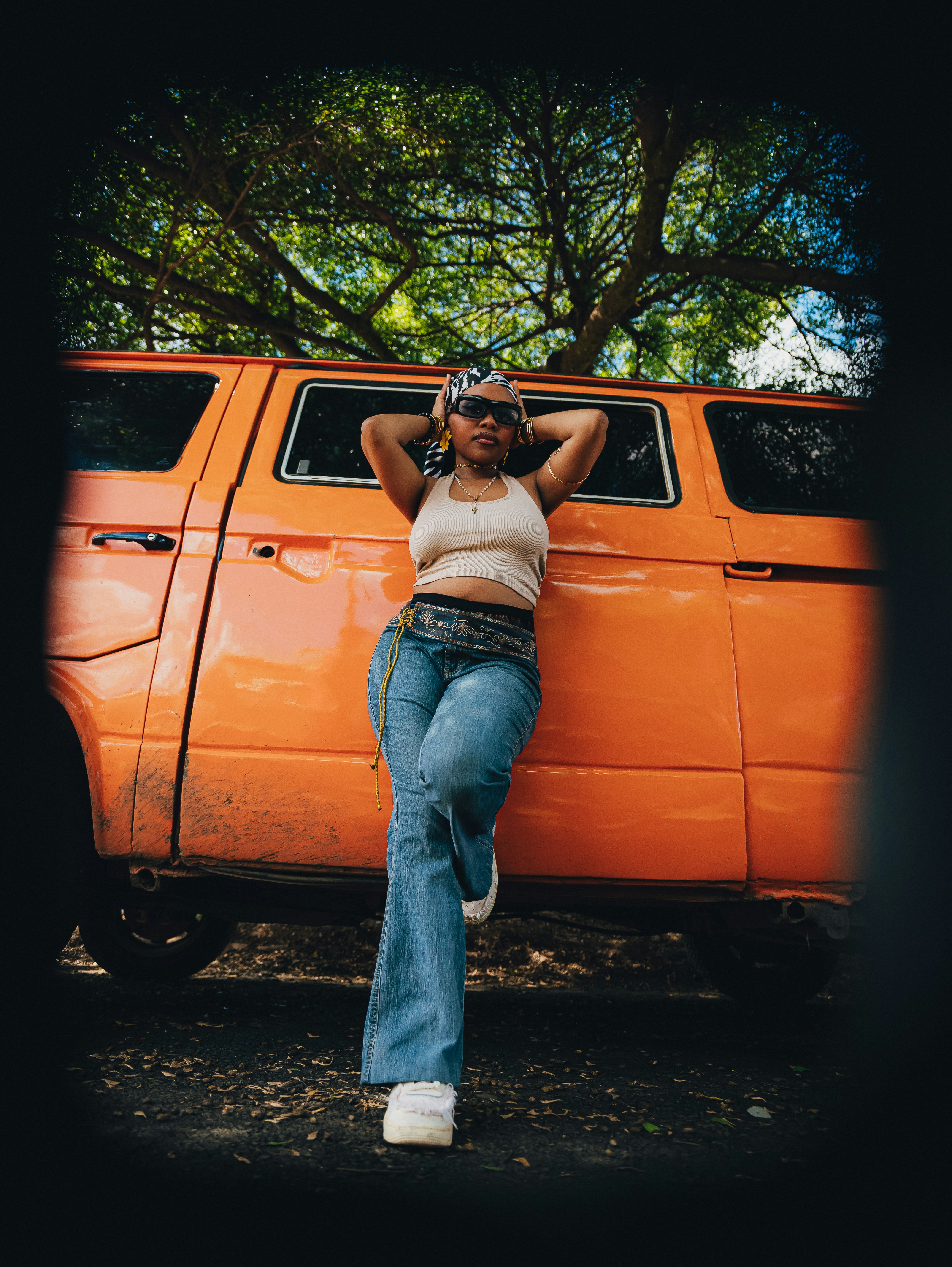 Orange Van, Cool Pose: A Portrait Against a Sunset Hue