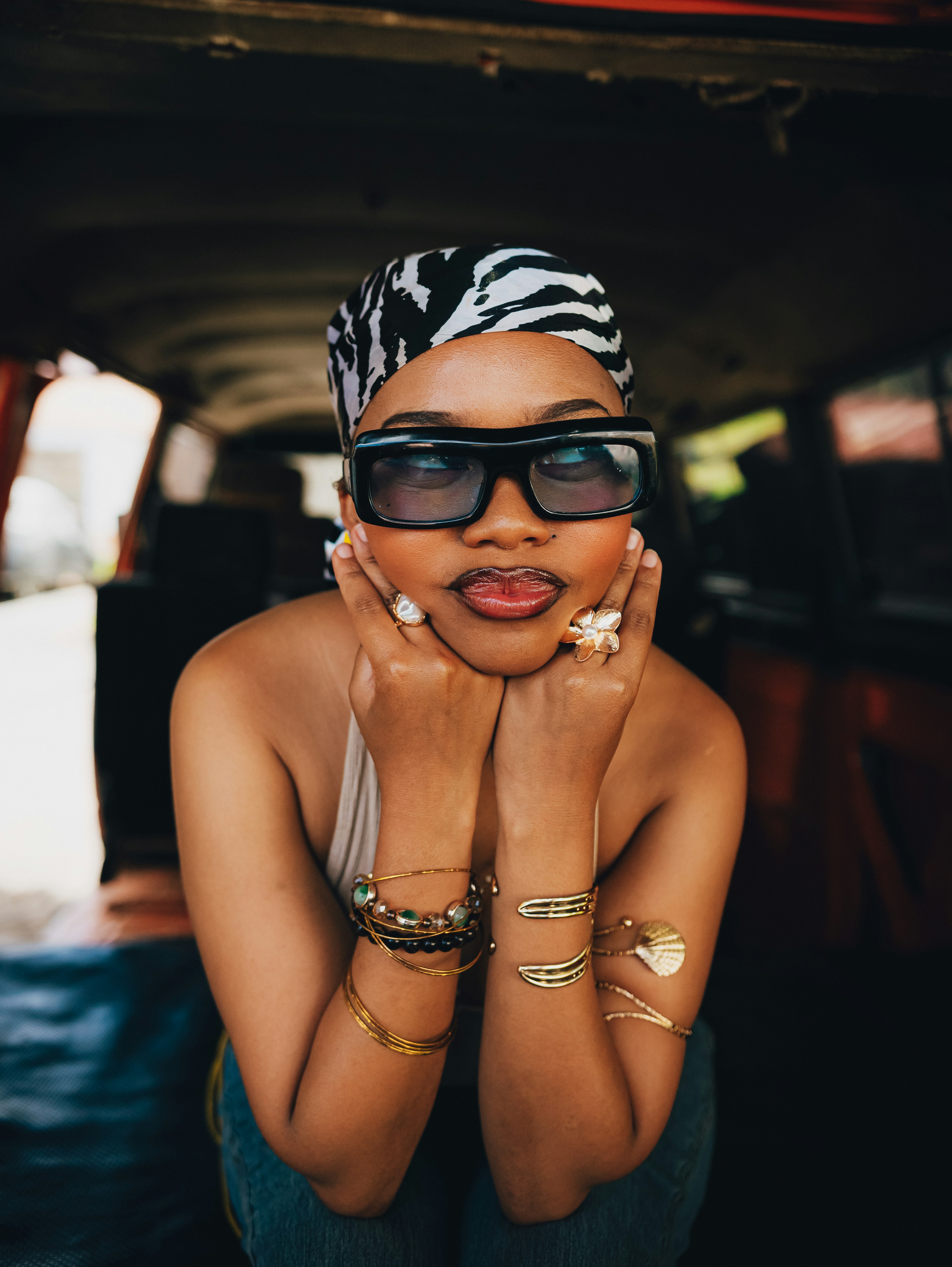 Portrait in a Velvet Shade: Bold Sunglasses and Gold Adornments Under the Berber Bandana