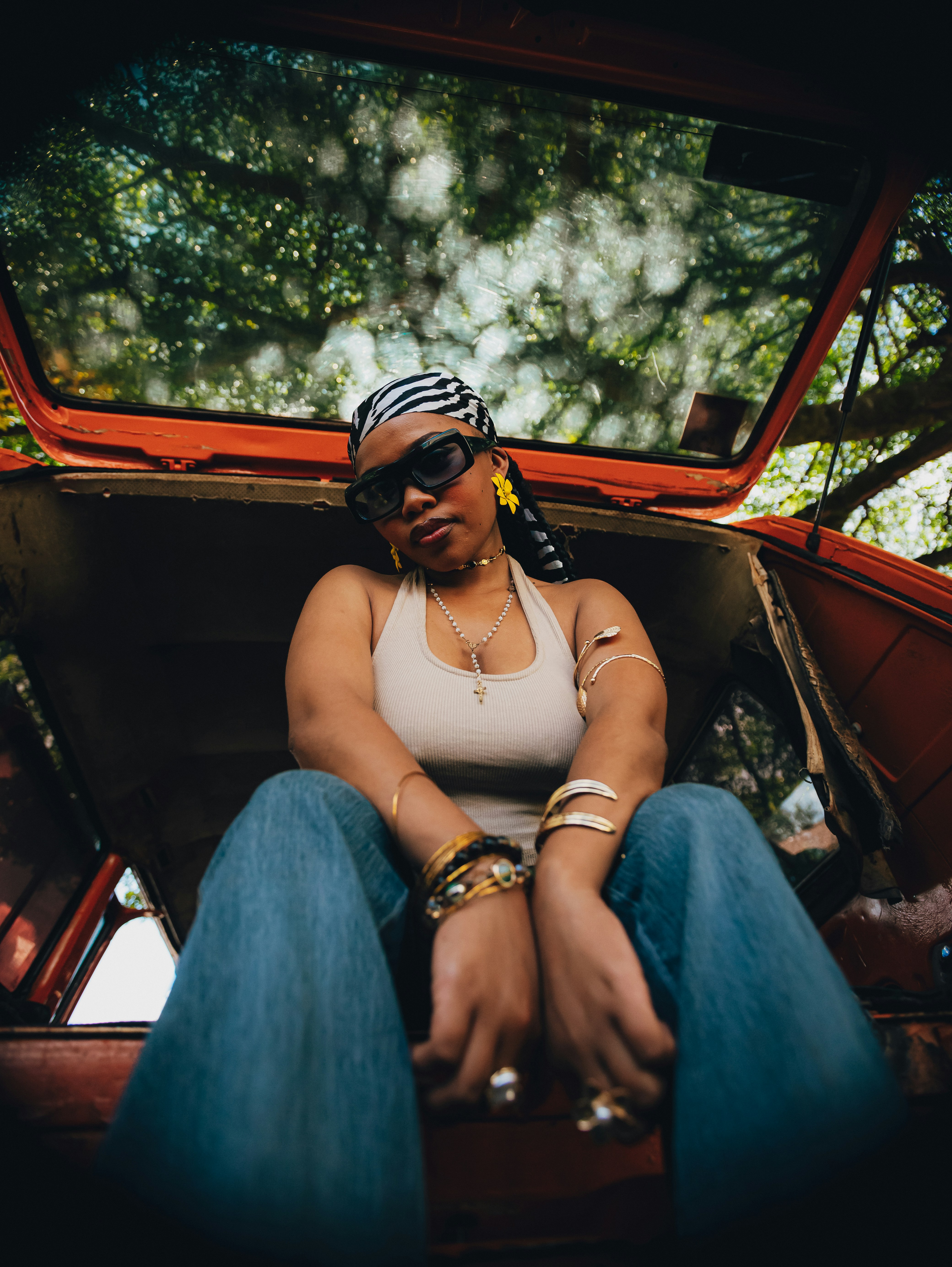 Low-Angle Portrait in a Red Car Trunk
