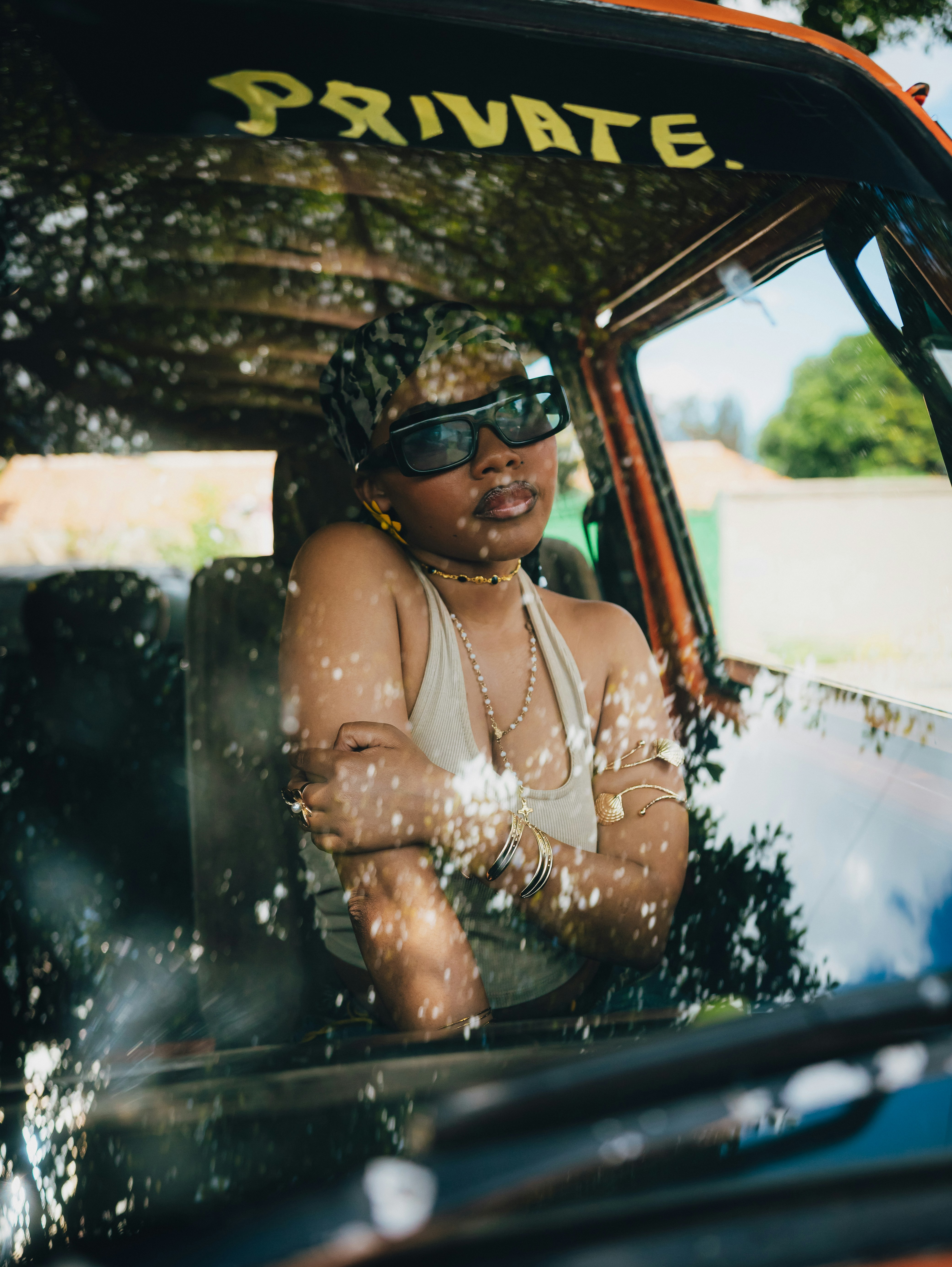 Private Ride: A Sunglassed Moment Behind the Windshield
