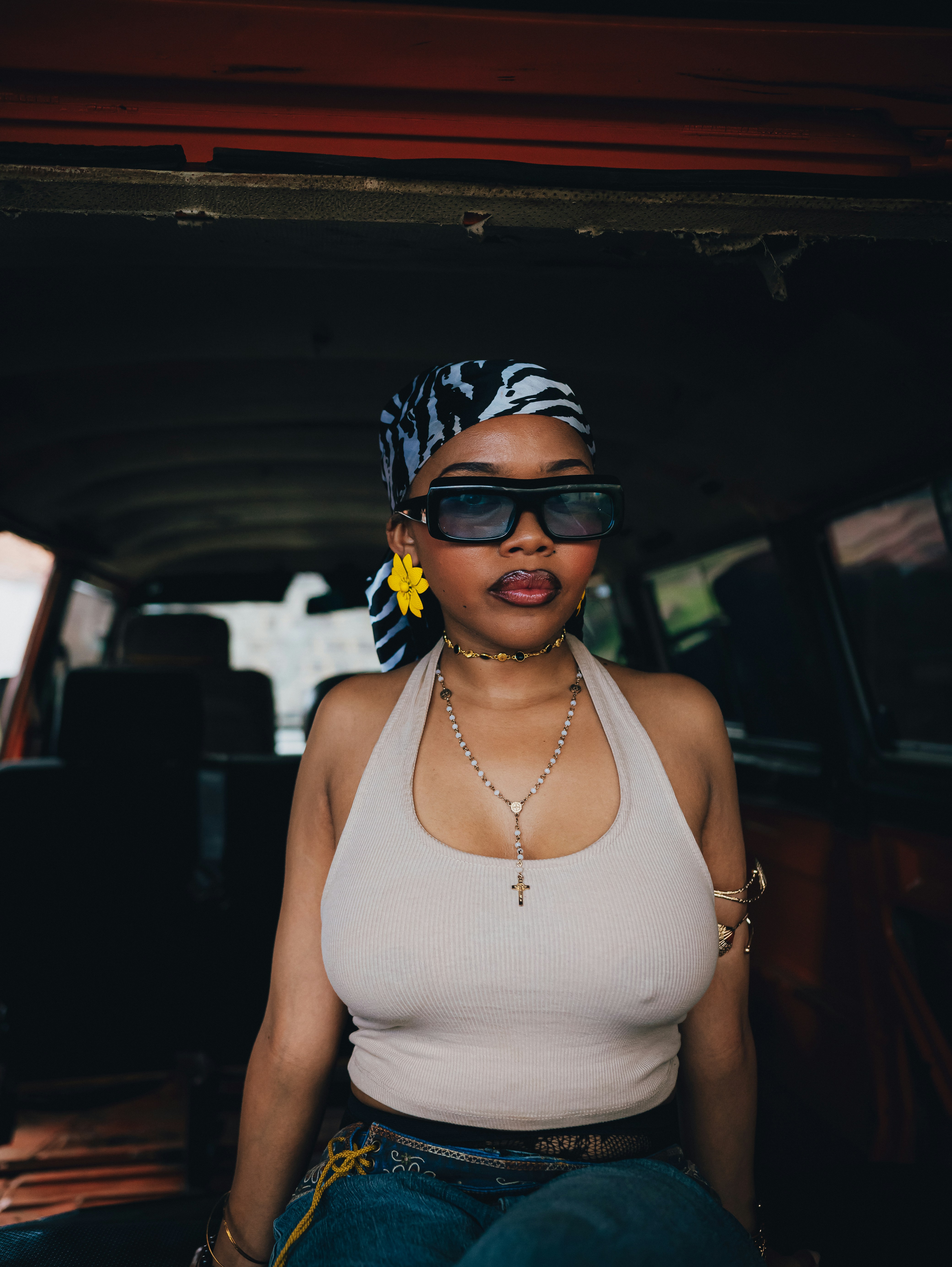 Portrait in a Vintage-Style Vehicle: Bold Confidence Under Ambient Light