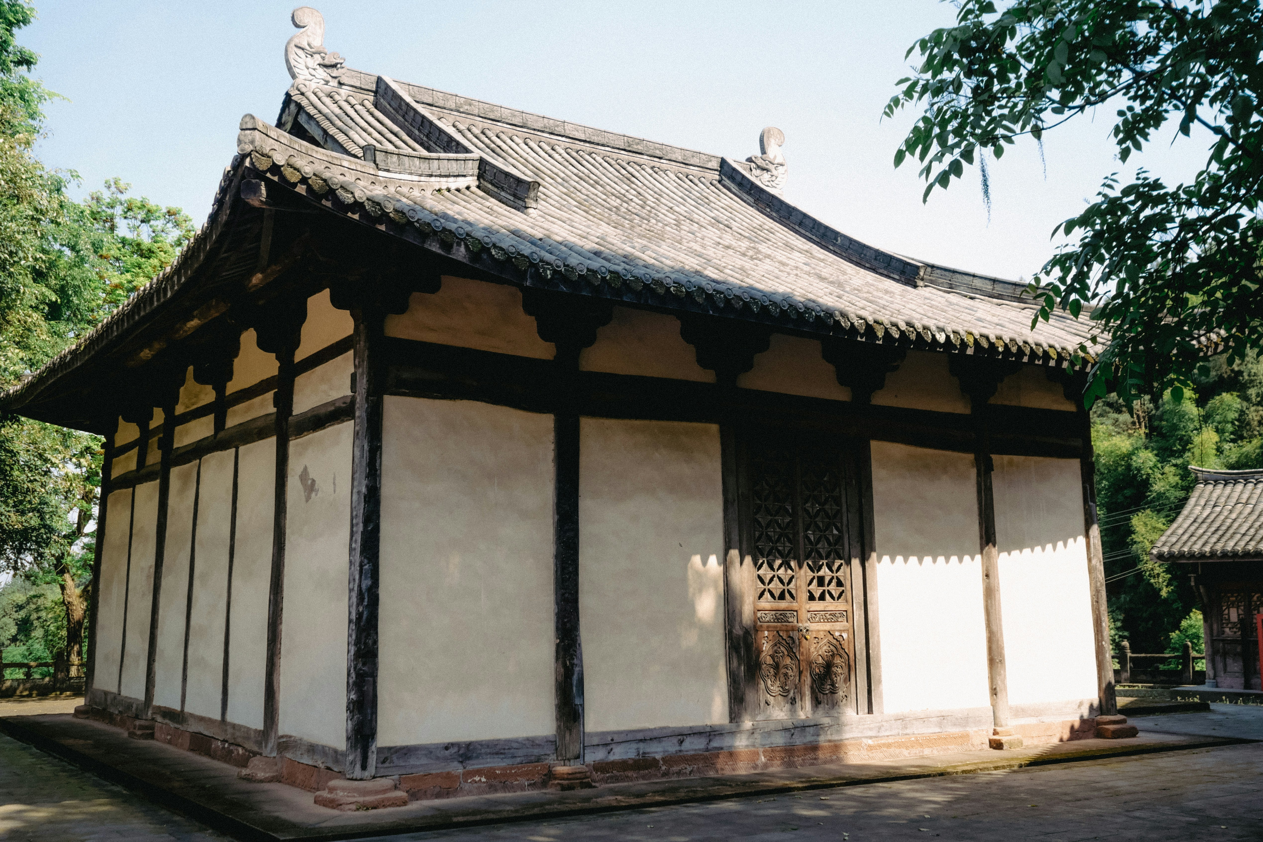 Timeless Temple with Shaded Courtyard and Carved Doorway