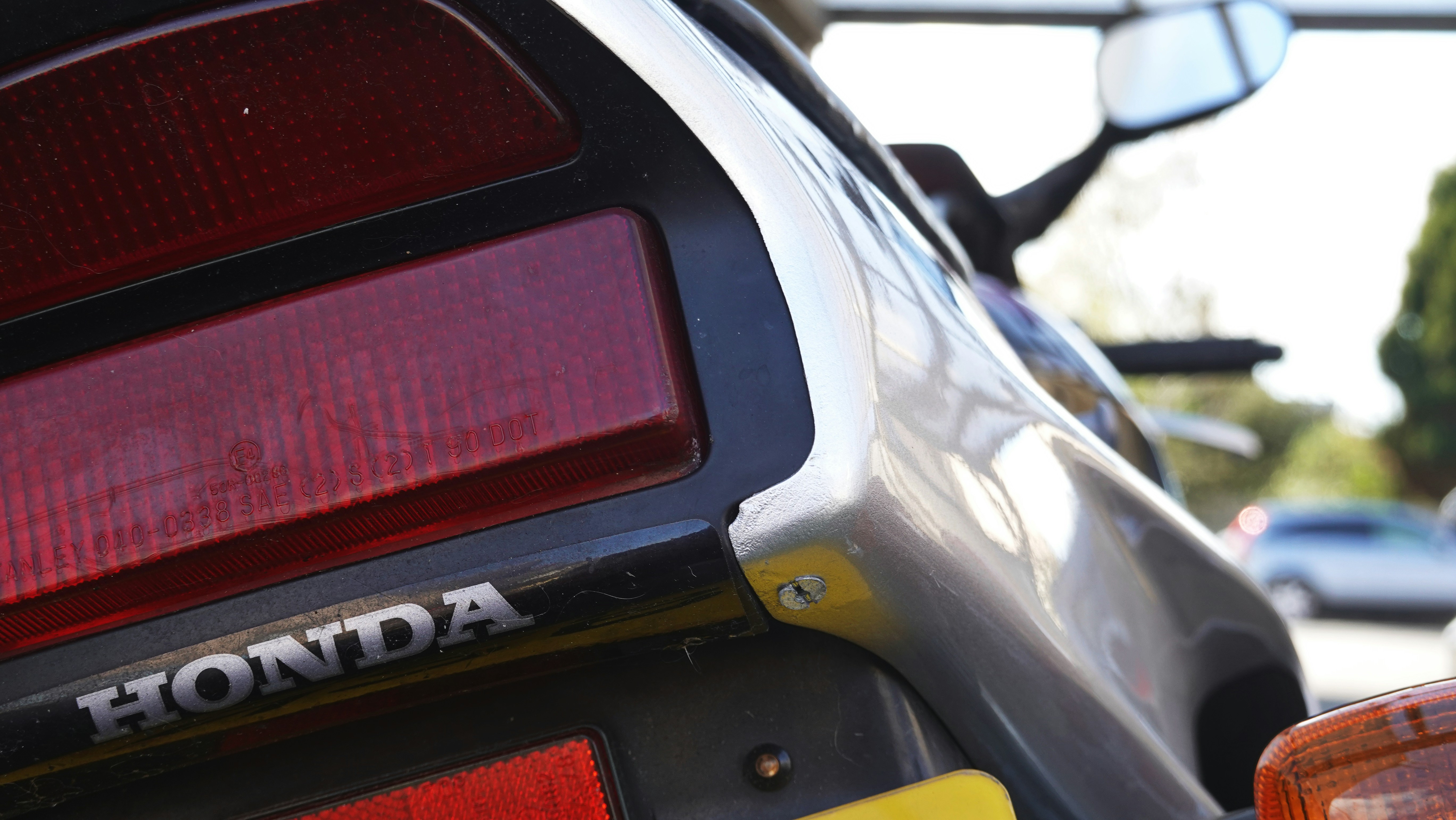 Chrome Curve: Rear View of a Honda Sports Pair
