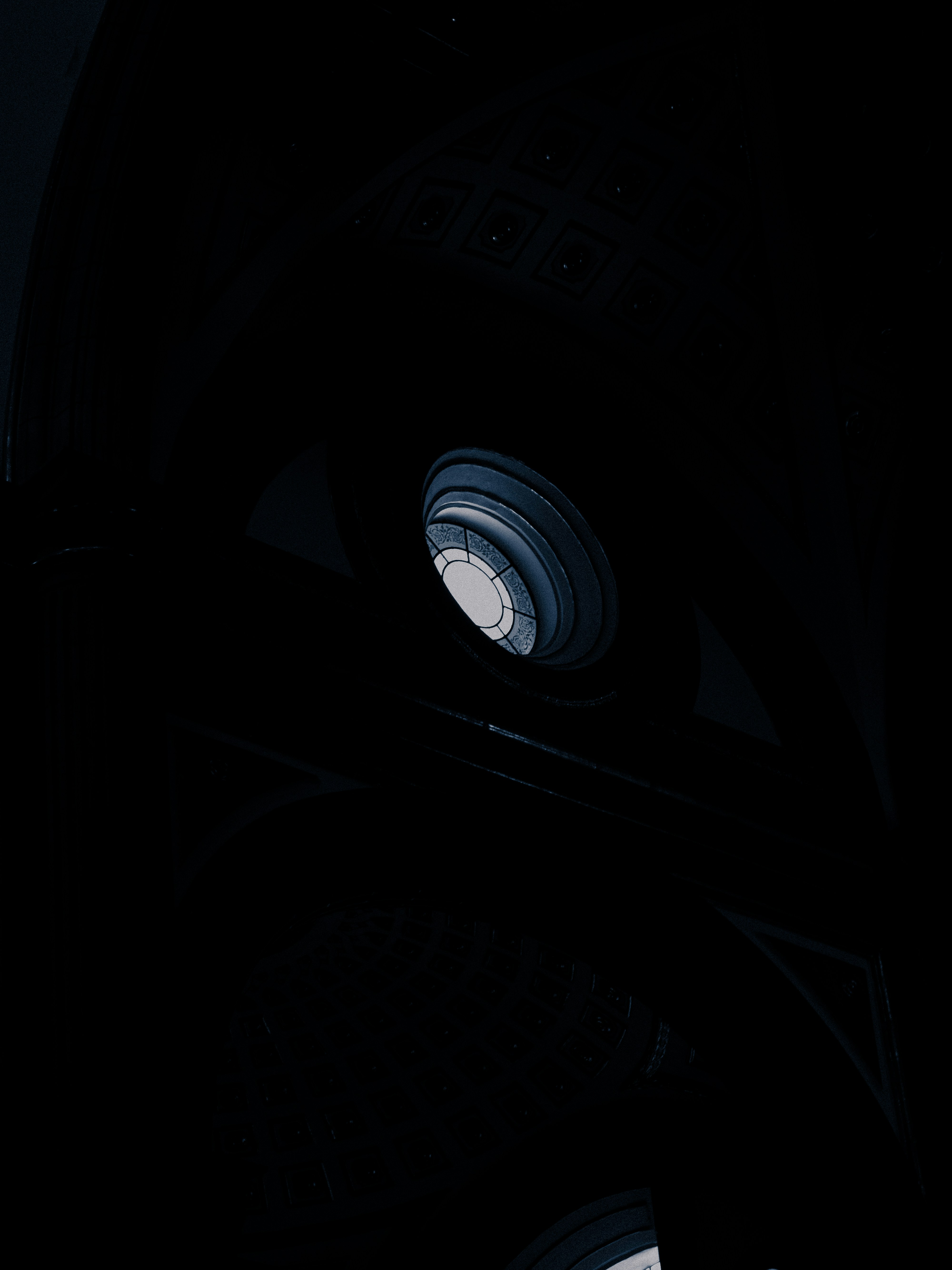 Midnight Dial: A Subtle Circular Focus in Dim Labyrinth