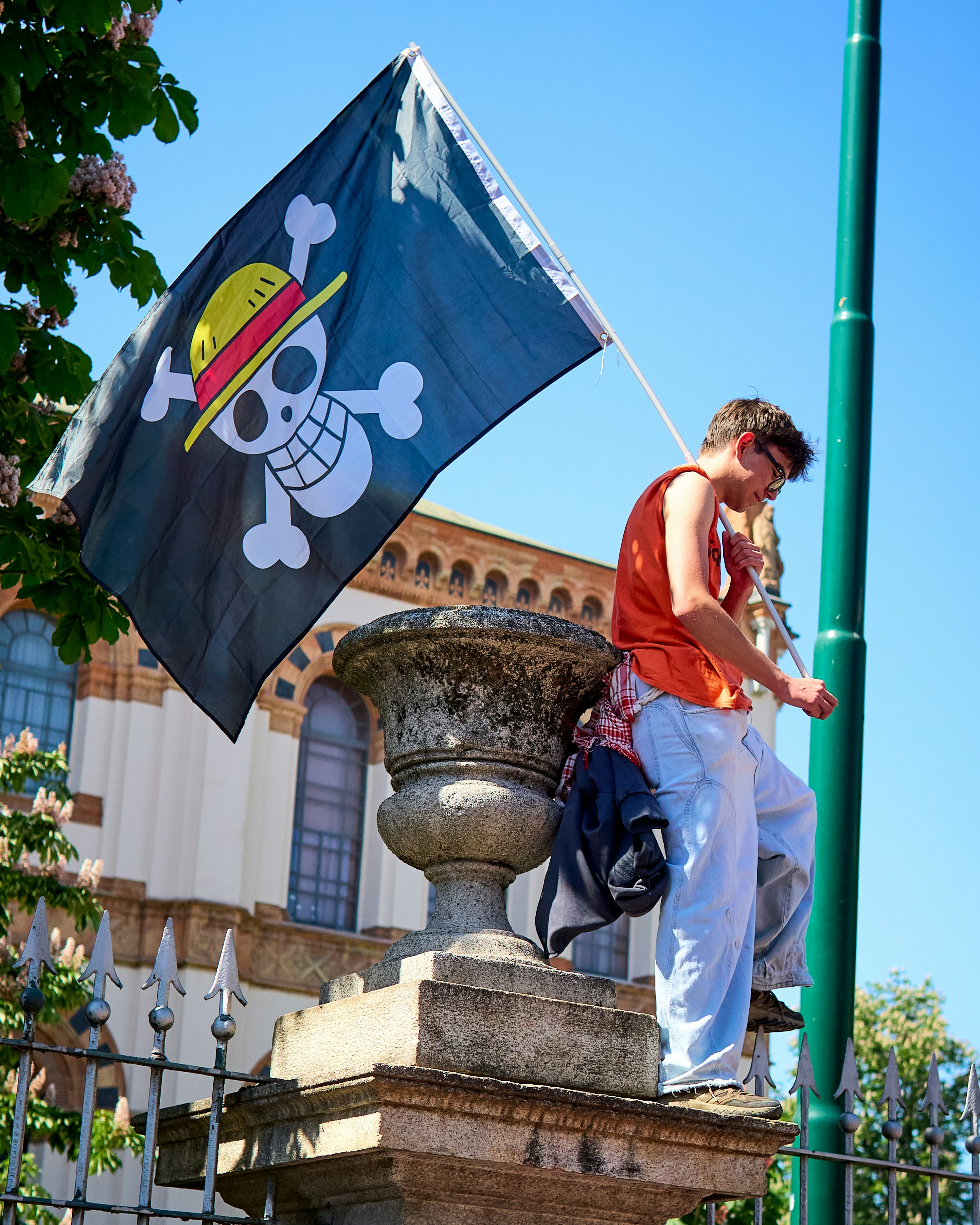 Skull & Flag Overlook: A Pirate Banner Flaps by the Fountain