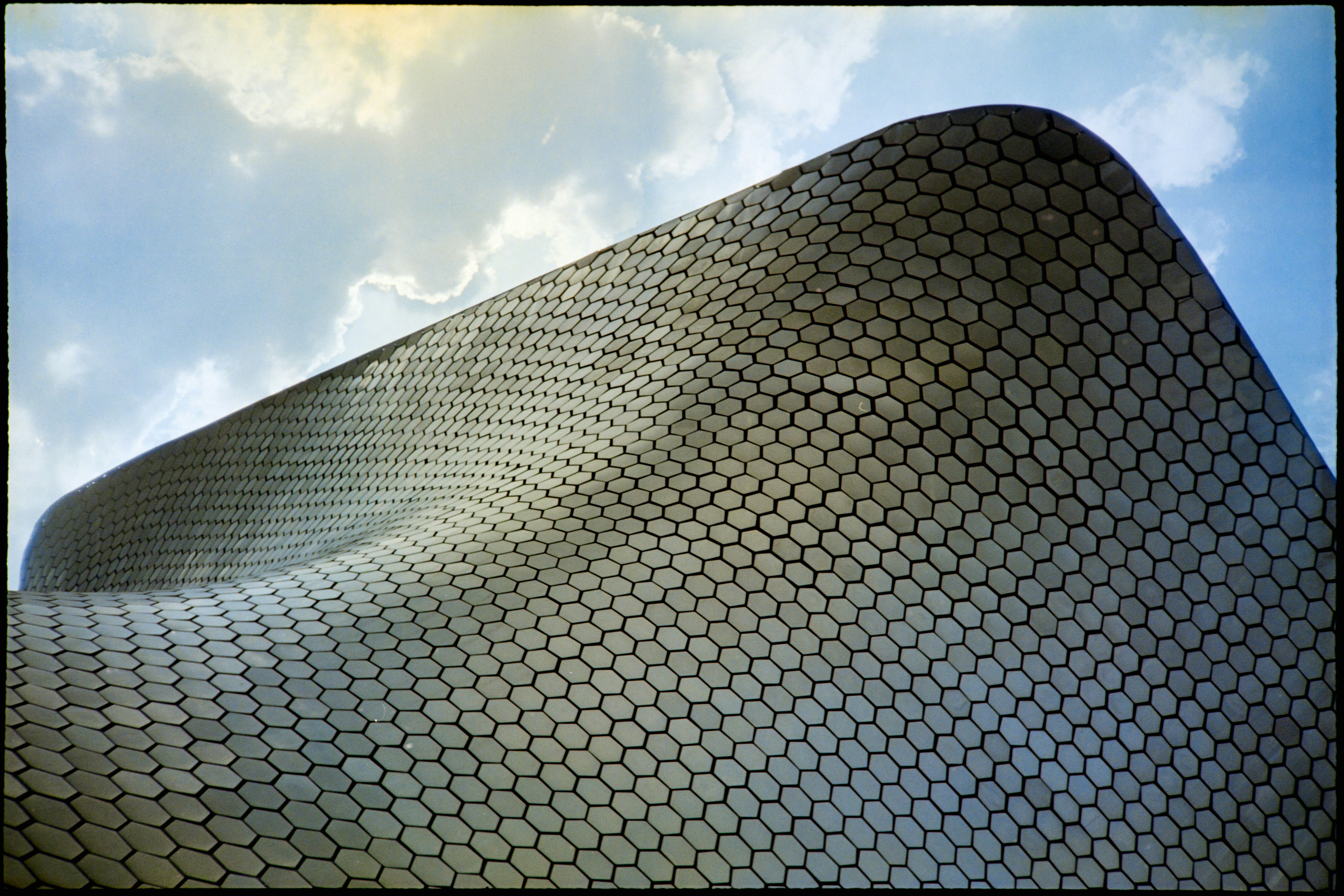 Hexagonal facade rising into the sky