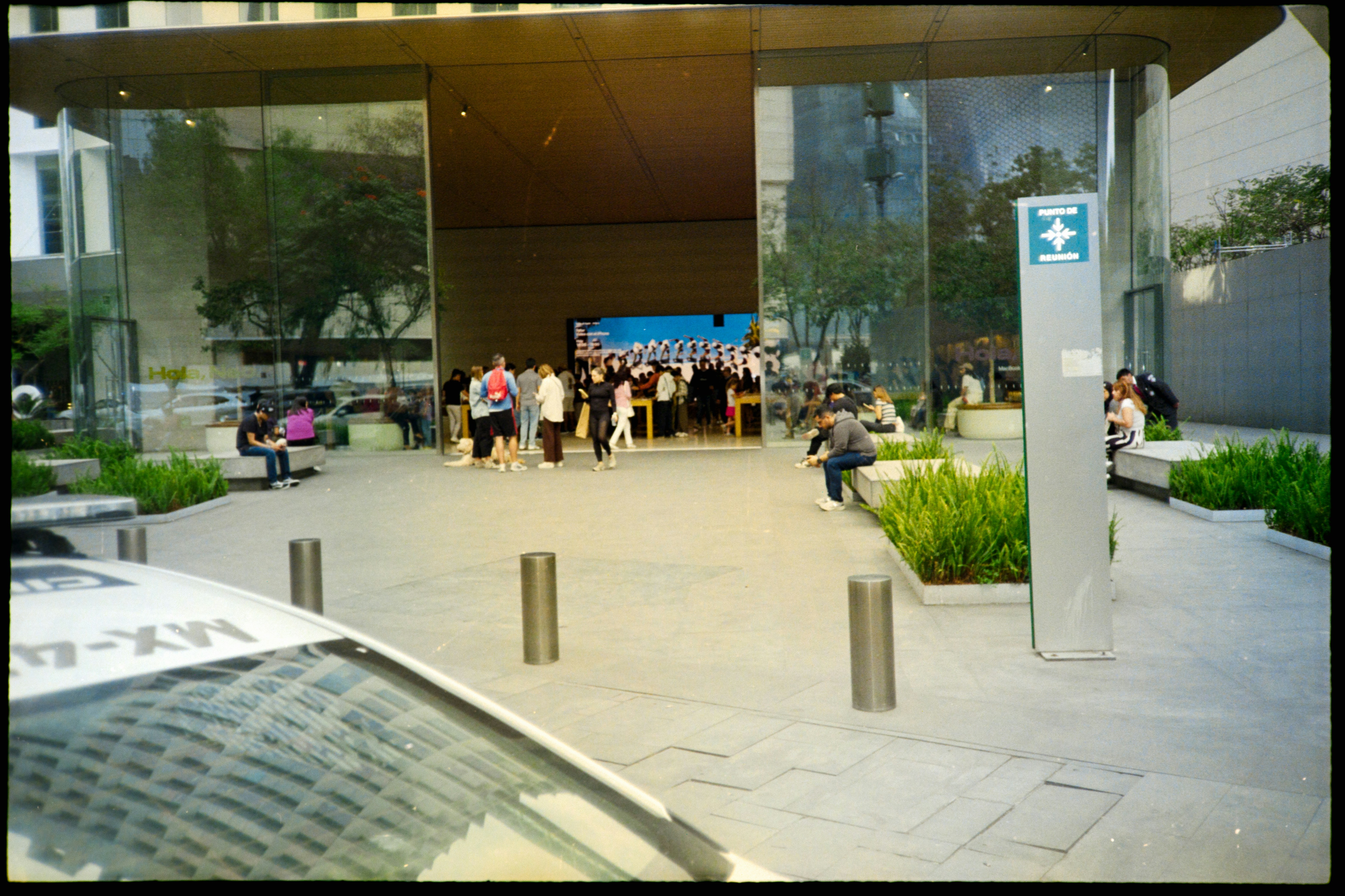 Center of Arrival: A Quiet Plaza Framed by Glass and People