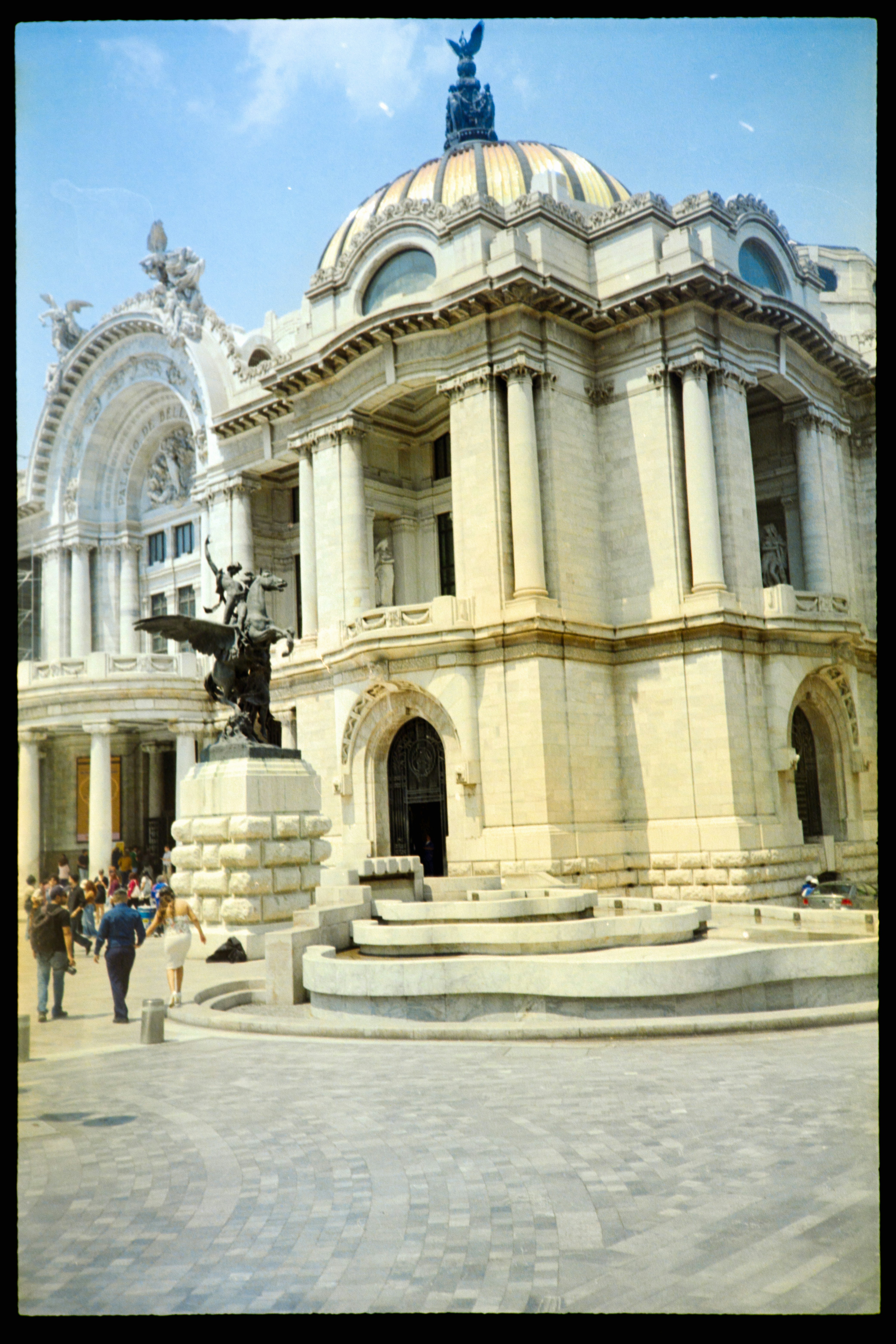 Courtyard Cathedral: Sculpted Dome and Winged Statue Fortify the Square
