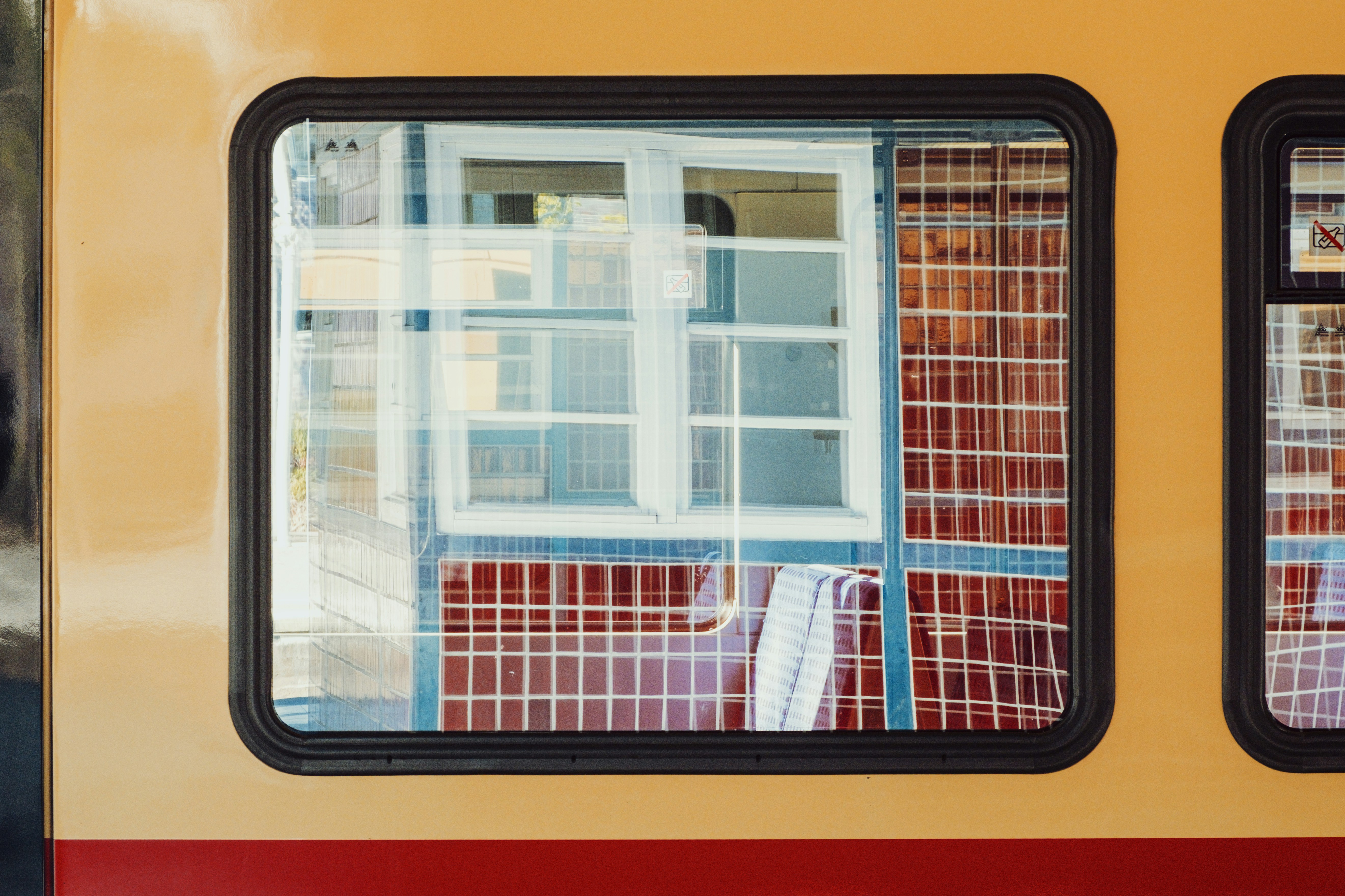 Reflection in a Train Window: Geometric Grid and Color Blocks