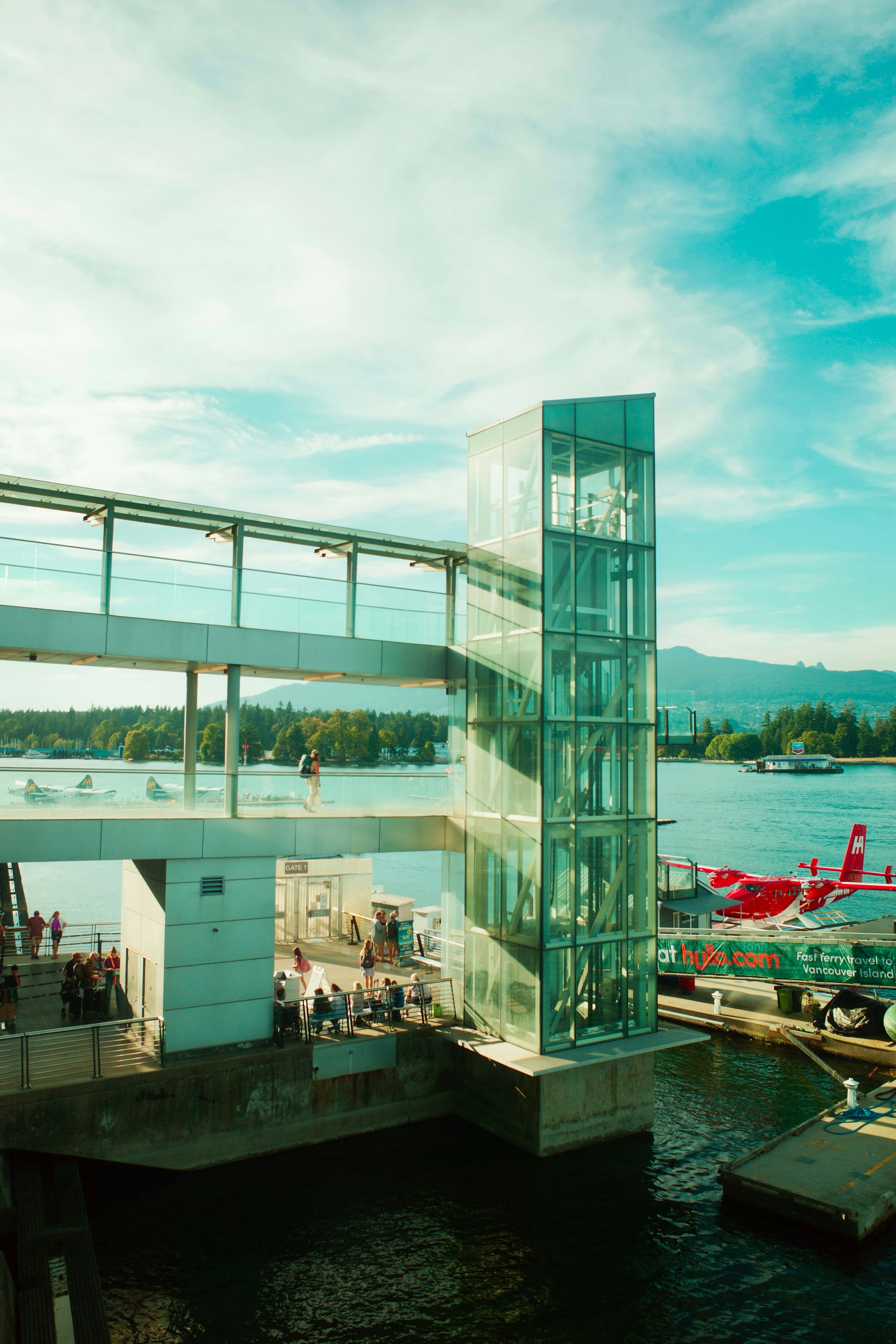 Glass Elevator Over the Marina: A Modern Pier Connects Sky and Water