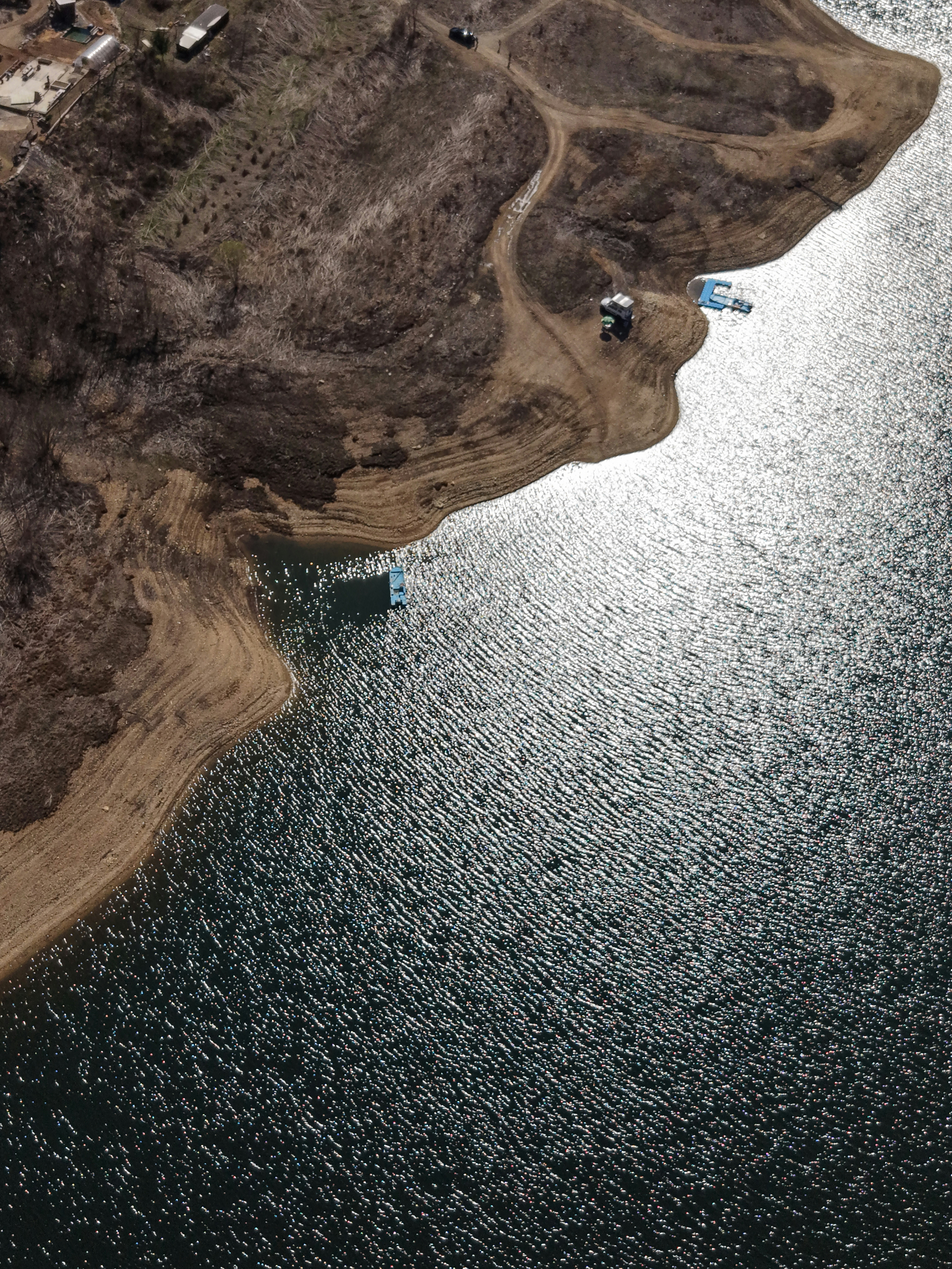 Terraced Shoreline: Docks Adrift on a Gentle Basin