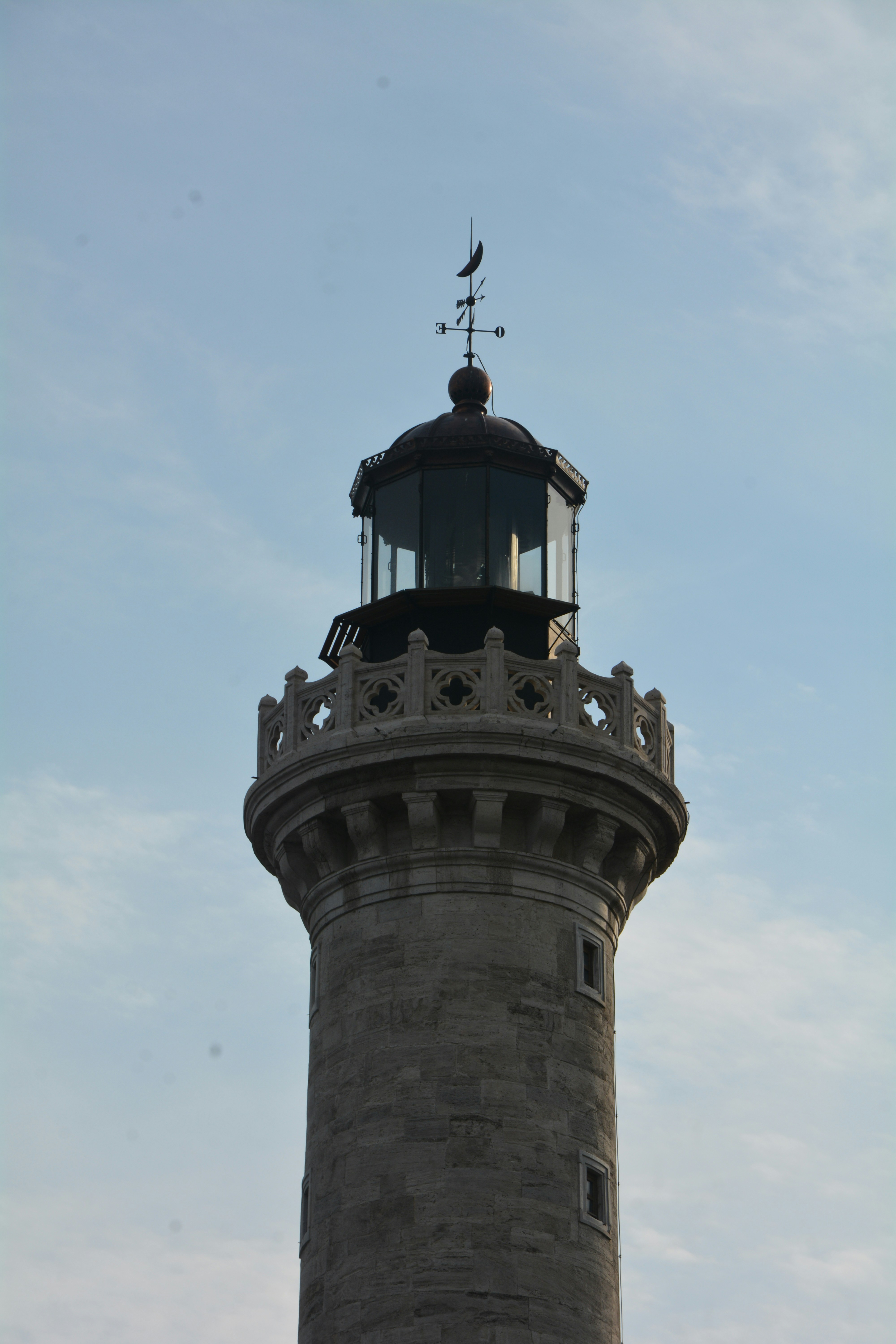 Beacon Against the Sky: A Coastal Lighthouse in Focus