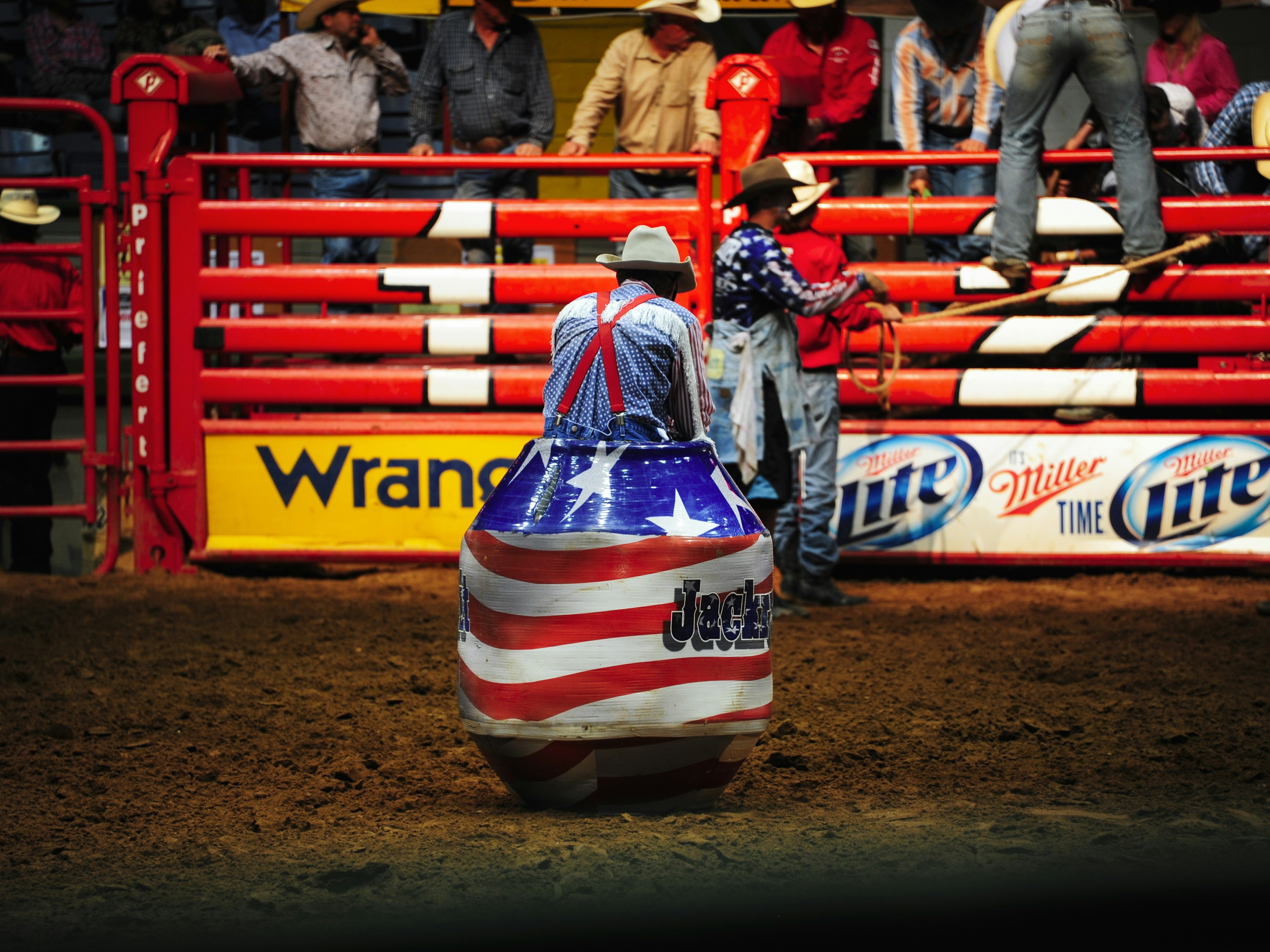 American Flair on the Ring: A Rodeo Barrel Spins Under Neon Mentions