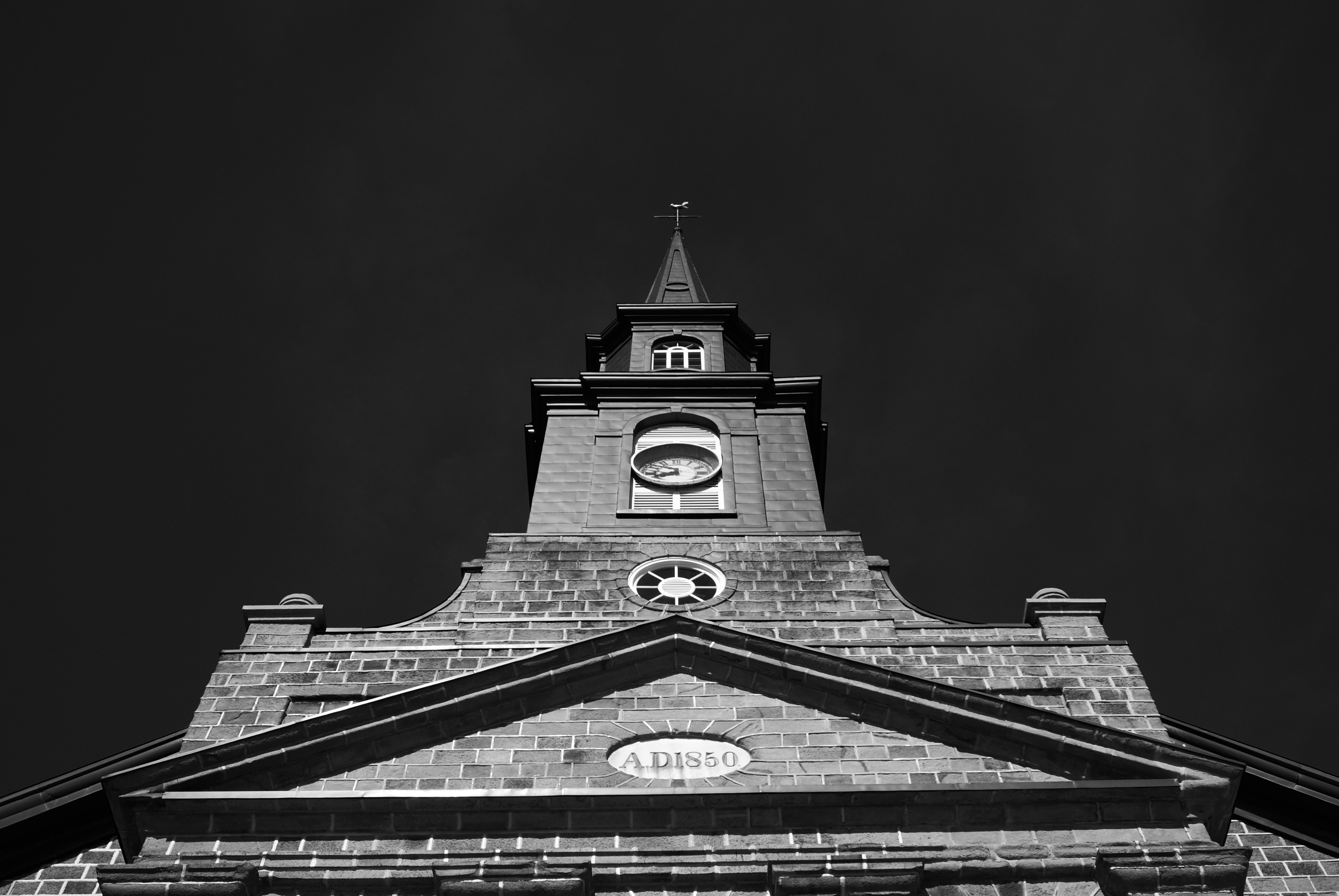 Symmetrical Bell-Tower Gable Reaches Toward the Night Sky