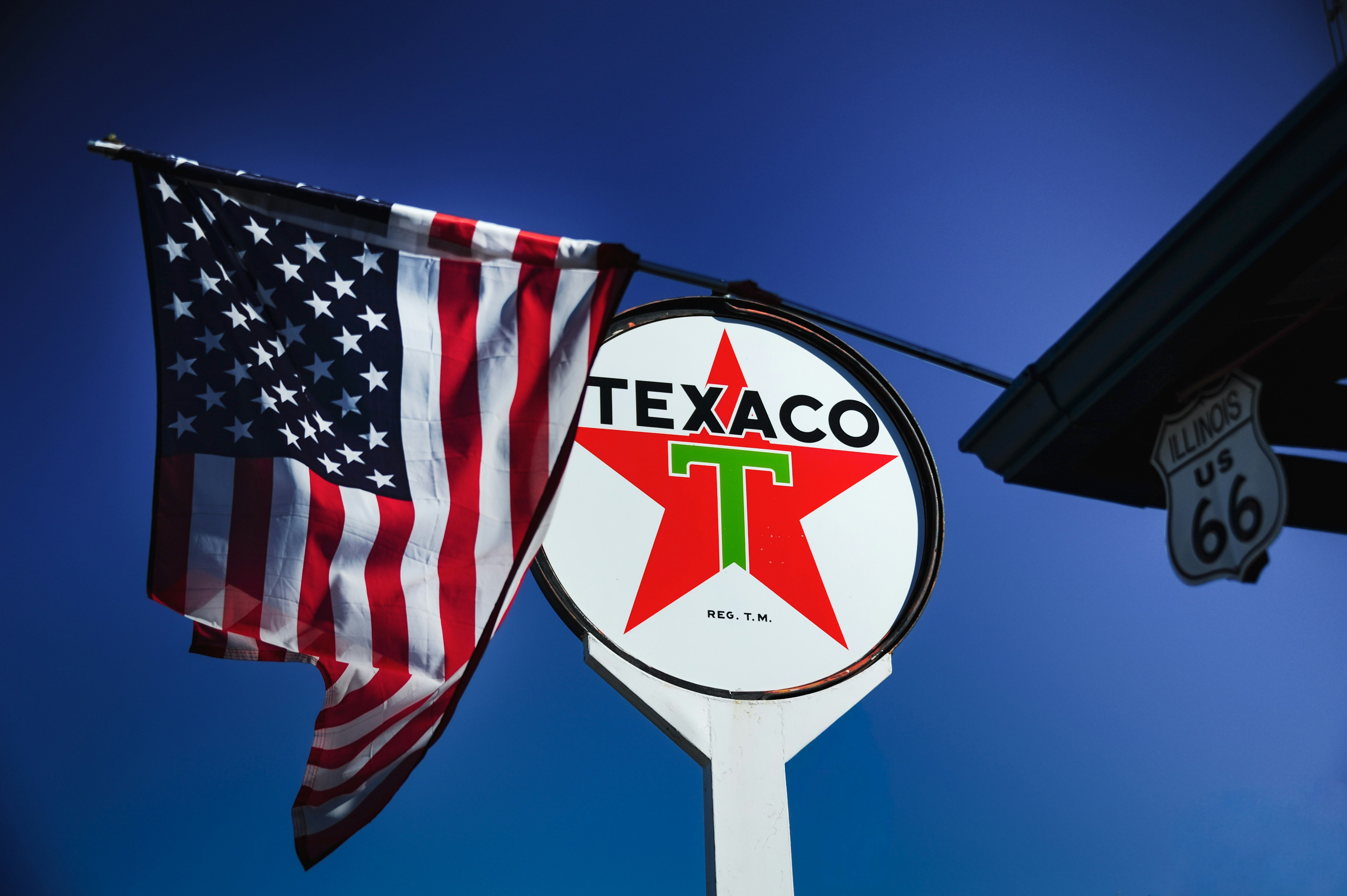 Flag and Texaco Sign: A Nostalgic Petrol Station Moment
