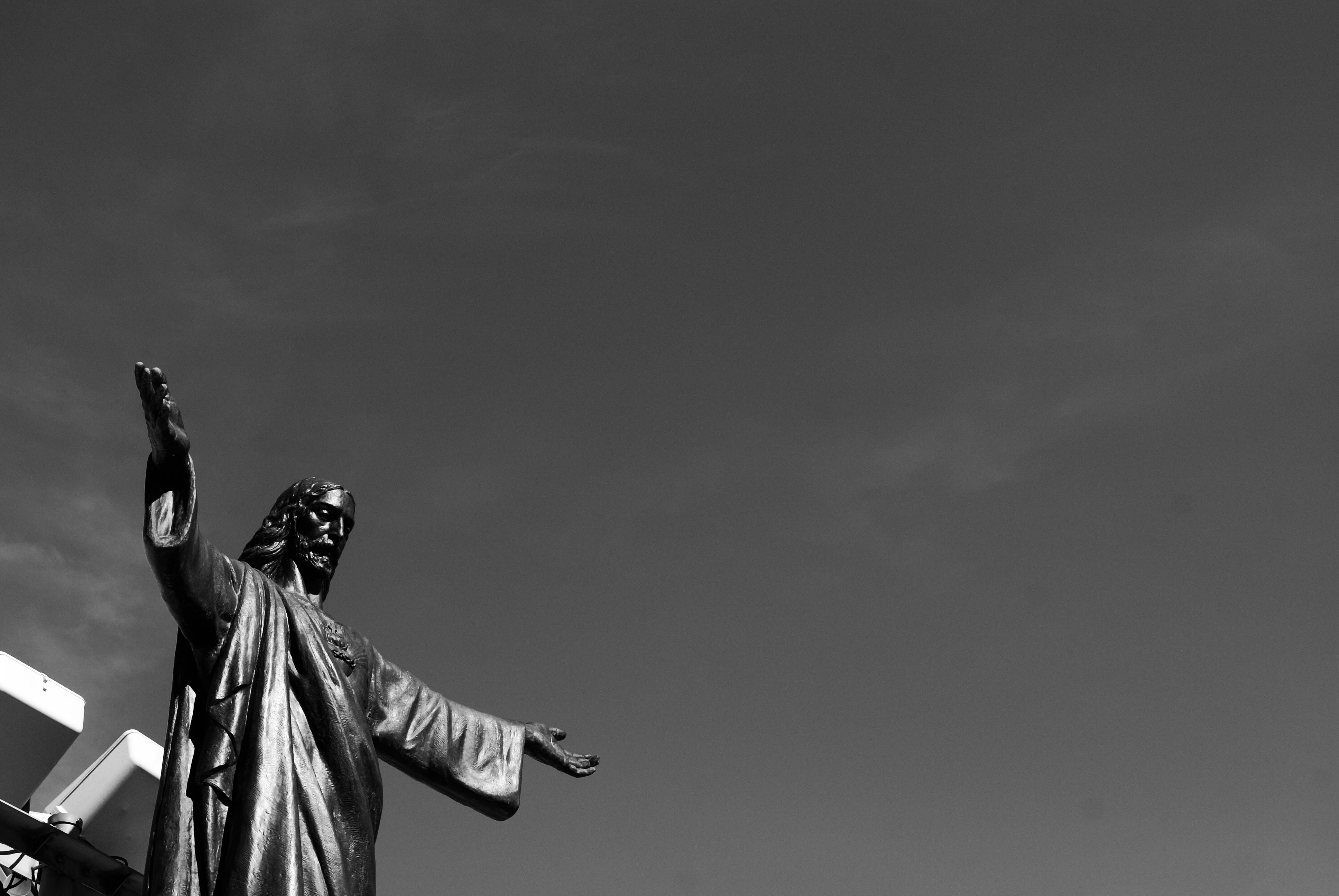 Trumpeting Silence: A Monumental Figure against a Wide Sky