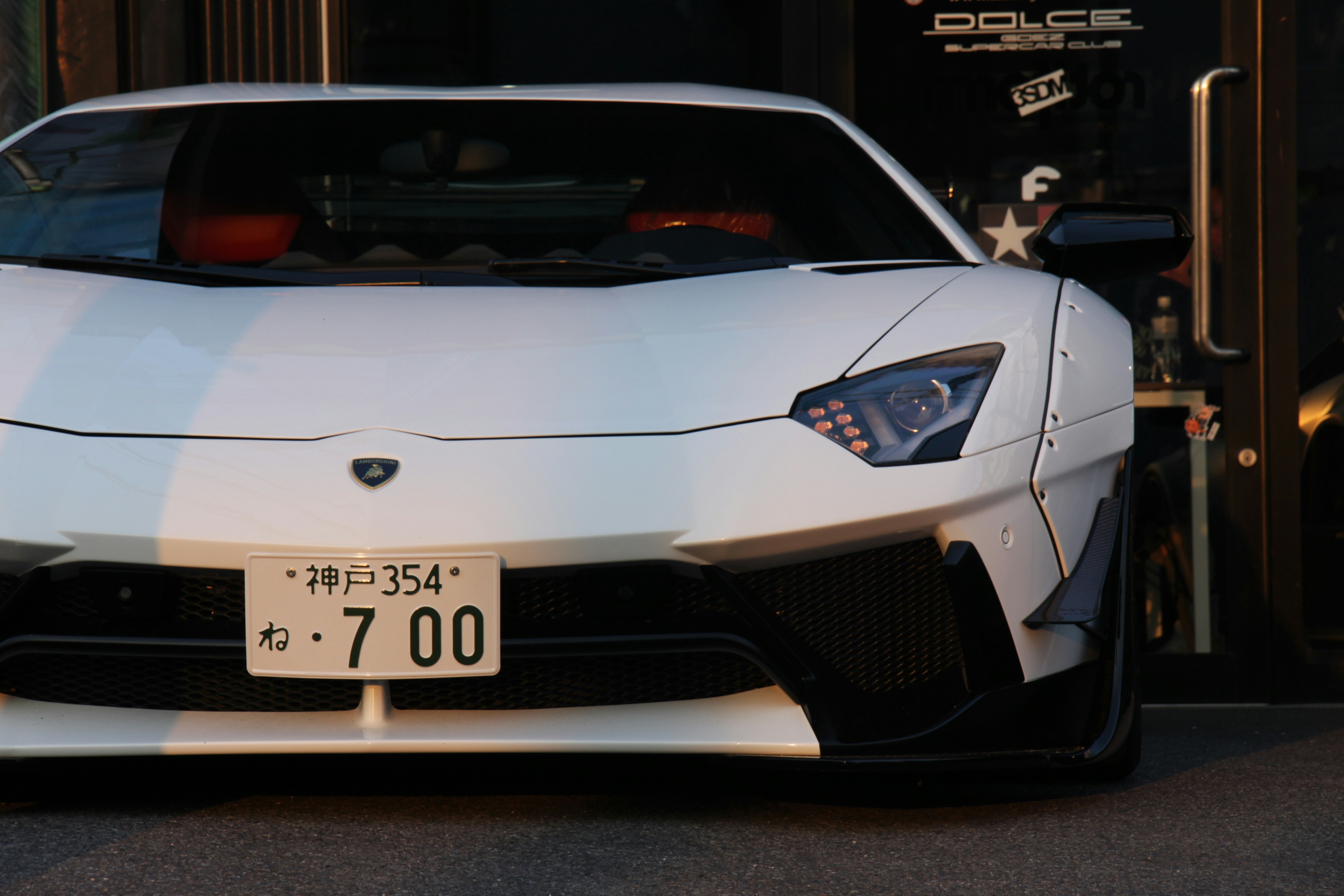 Low-Slung White Supercar at a Japanese Street Edge