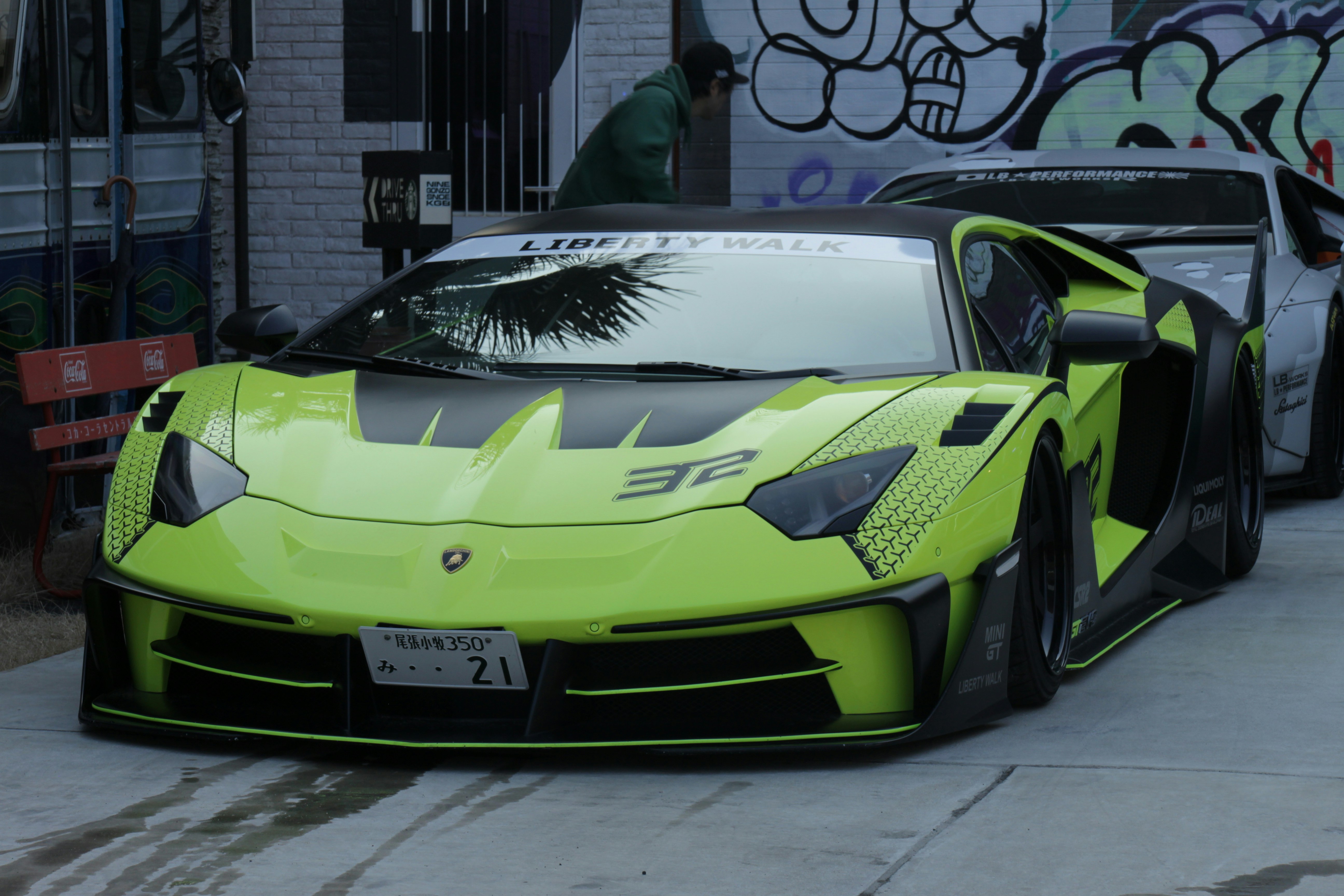 Lime Predator: A lime-green supercar in a graffiti-lined street