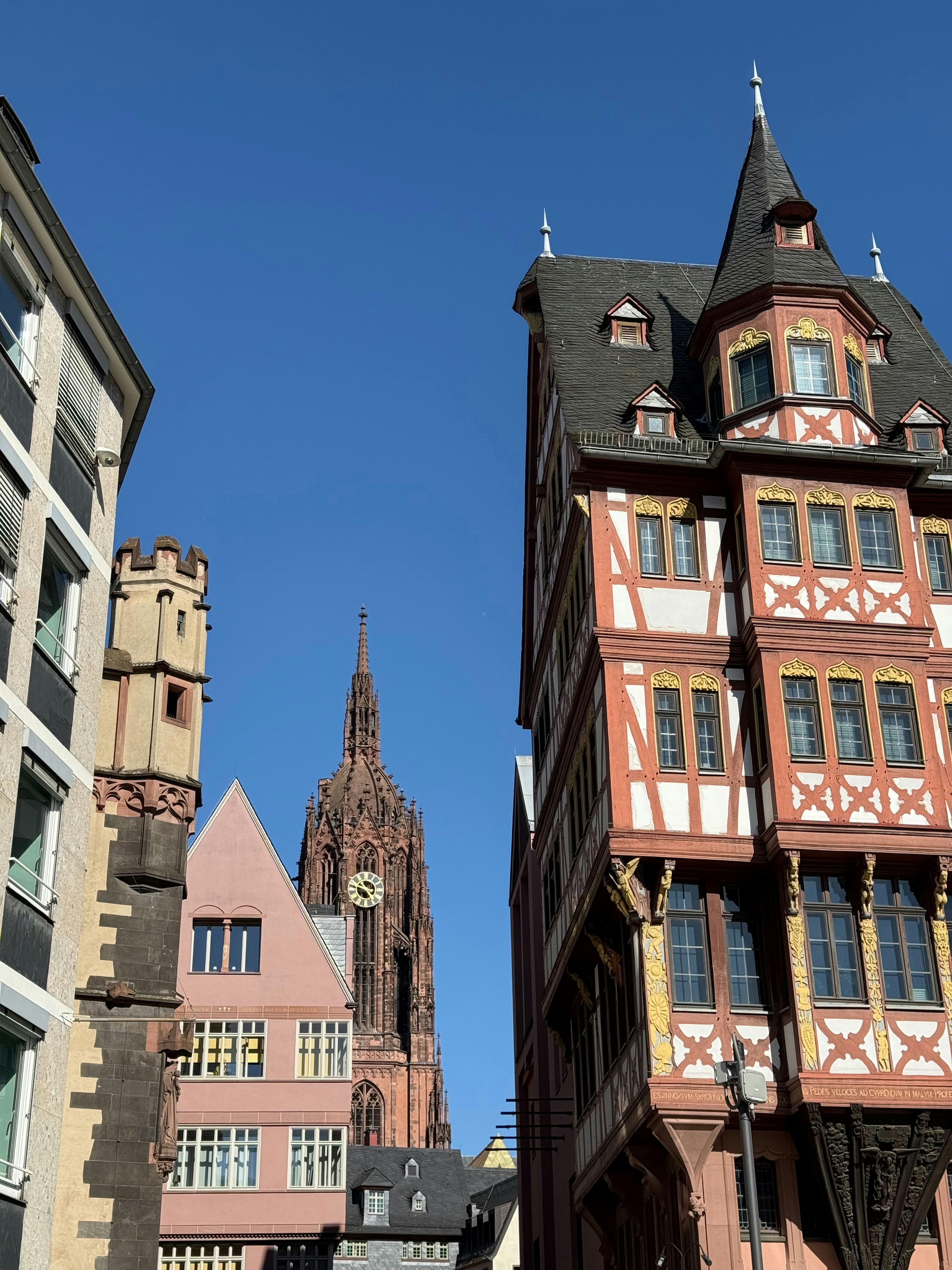 Facade Parade: A Narrow City Canyon of Timbered Architecture Under a Clear Sky