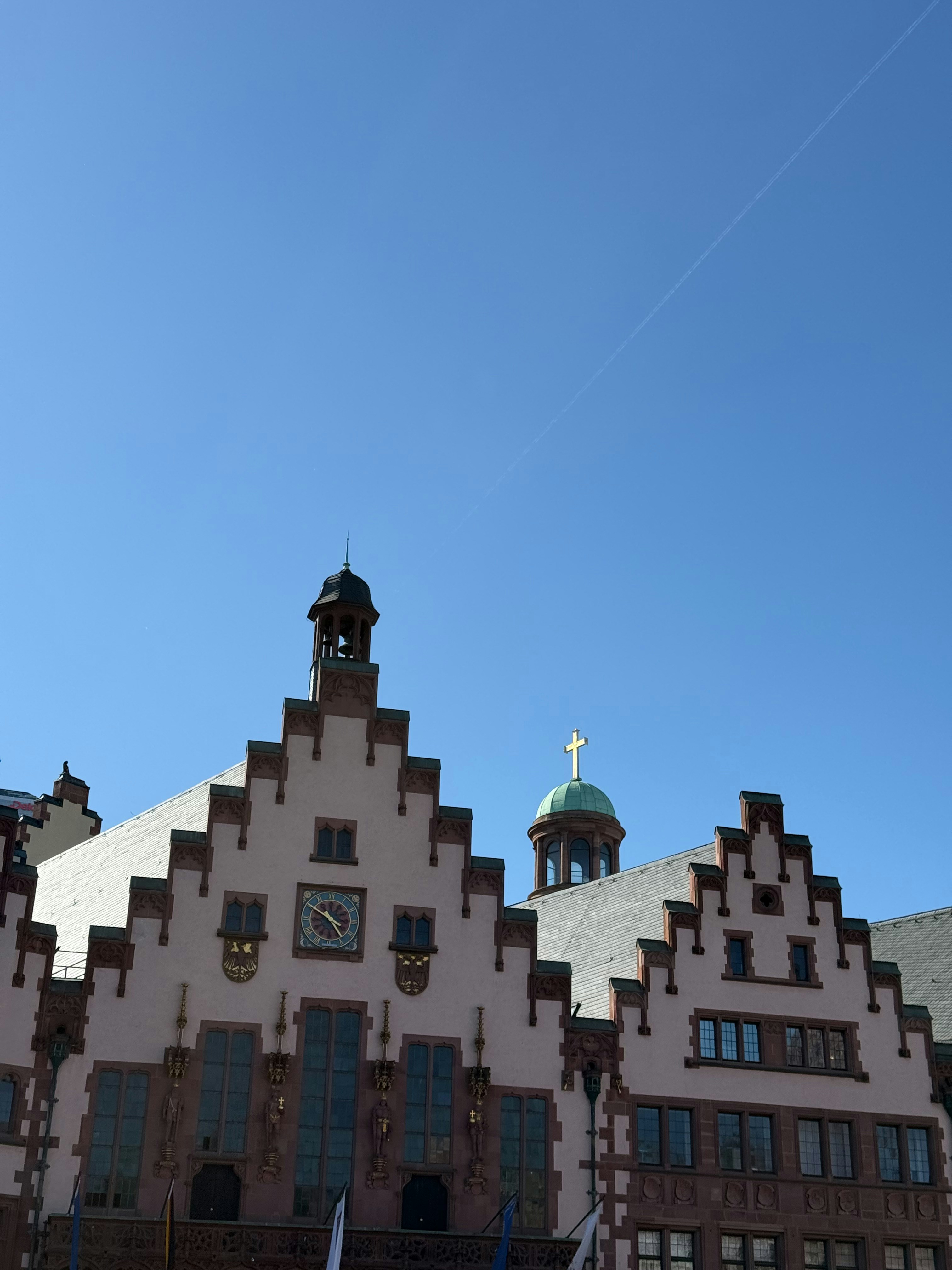 Rising Palaces: Gabled Facades Beneath a Clear Blue Sky