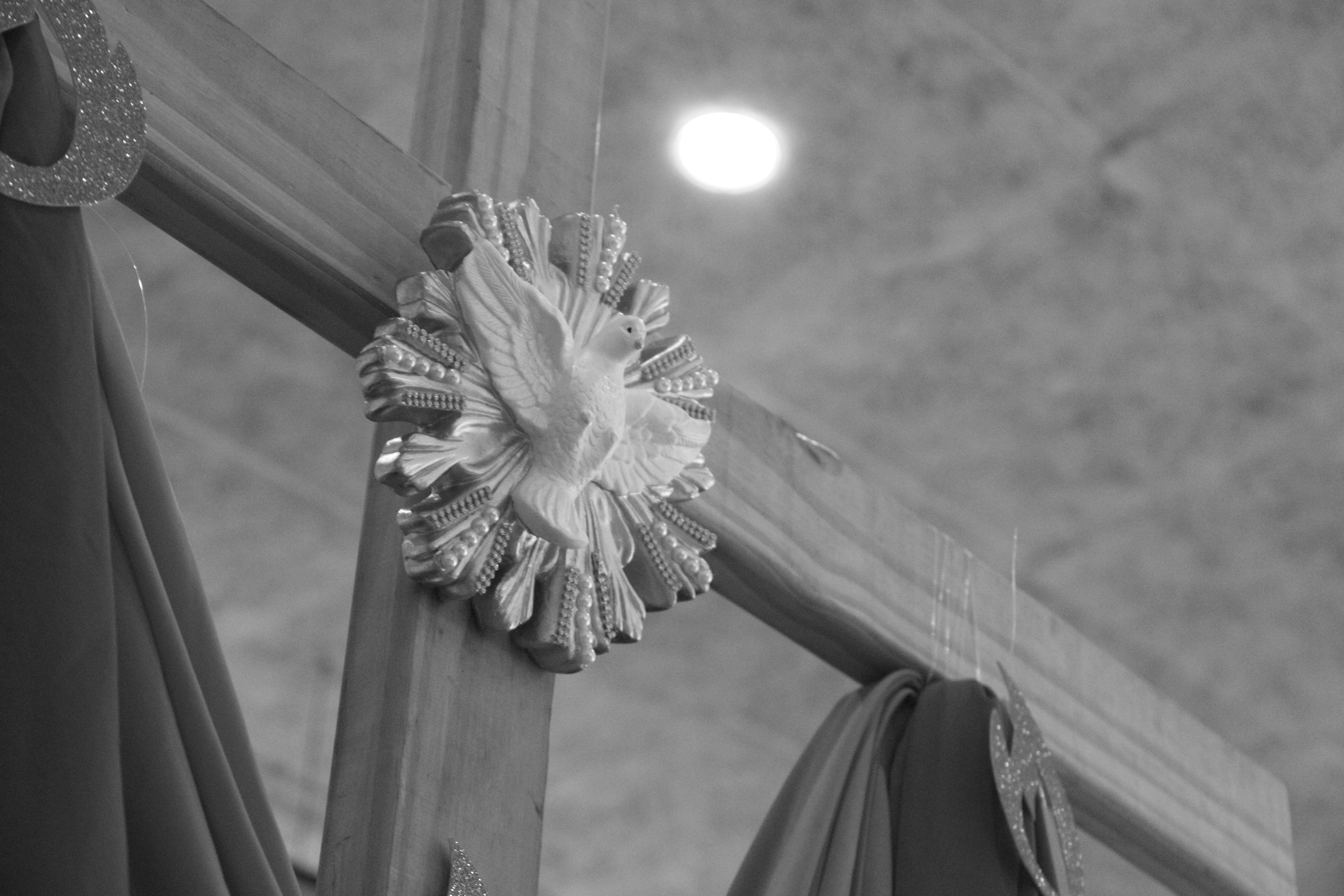 Embellished Closure: A Draped Ring of Craft on a Wooden Beam