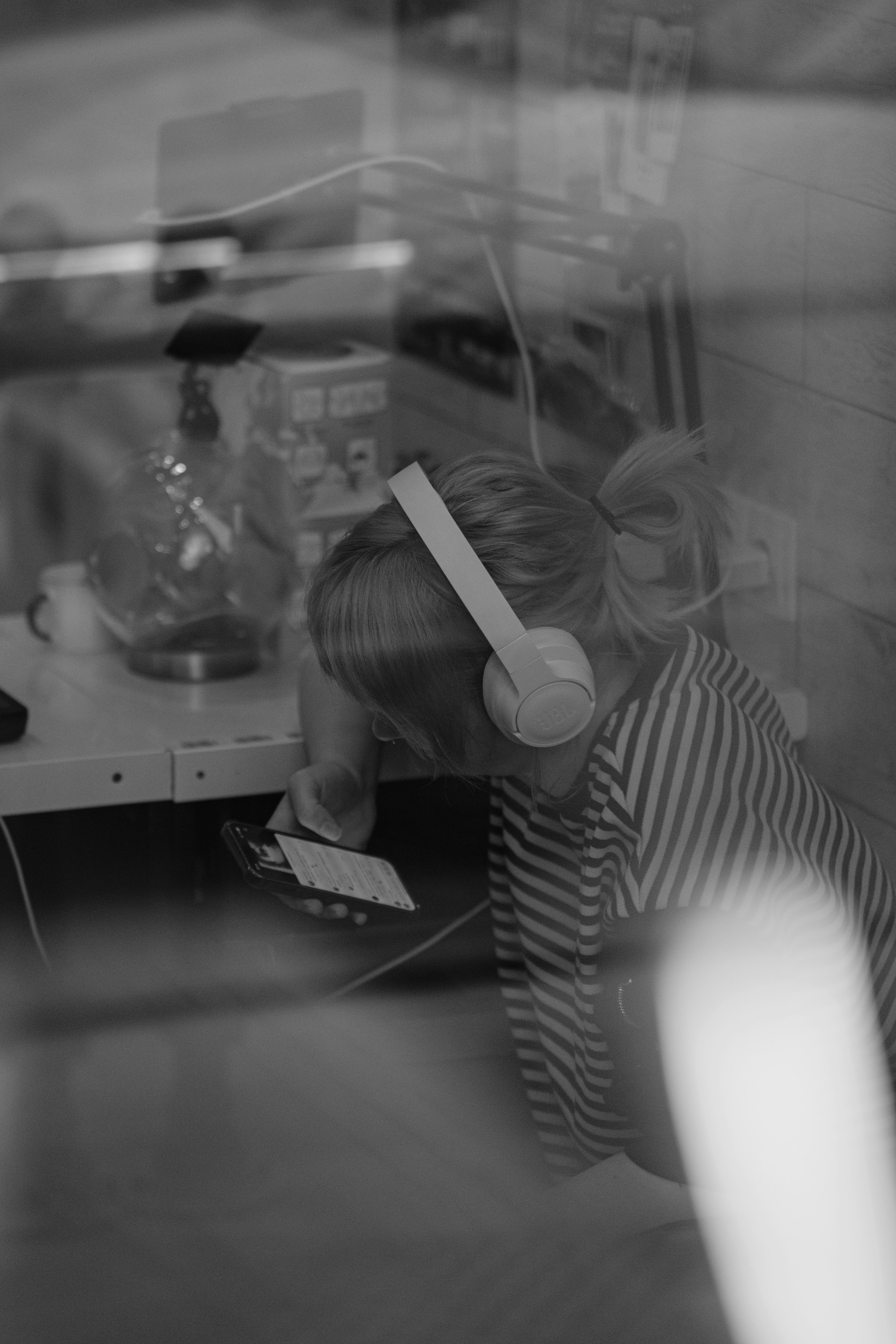 Through the Glass: Quiet Focus in a Neon-Tinted Moment