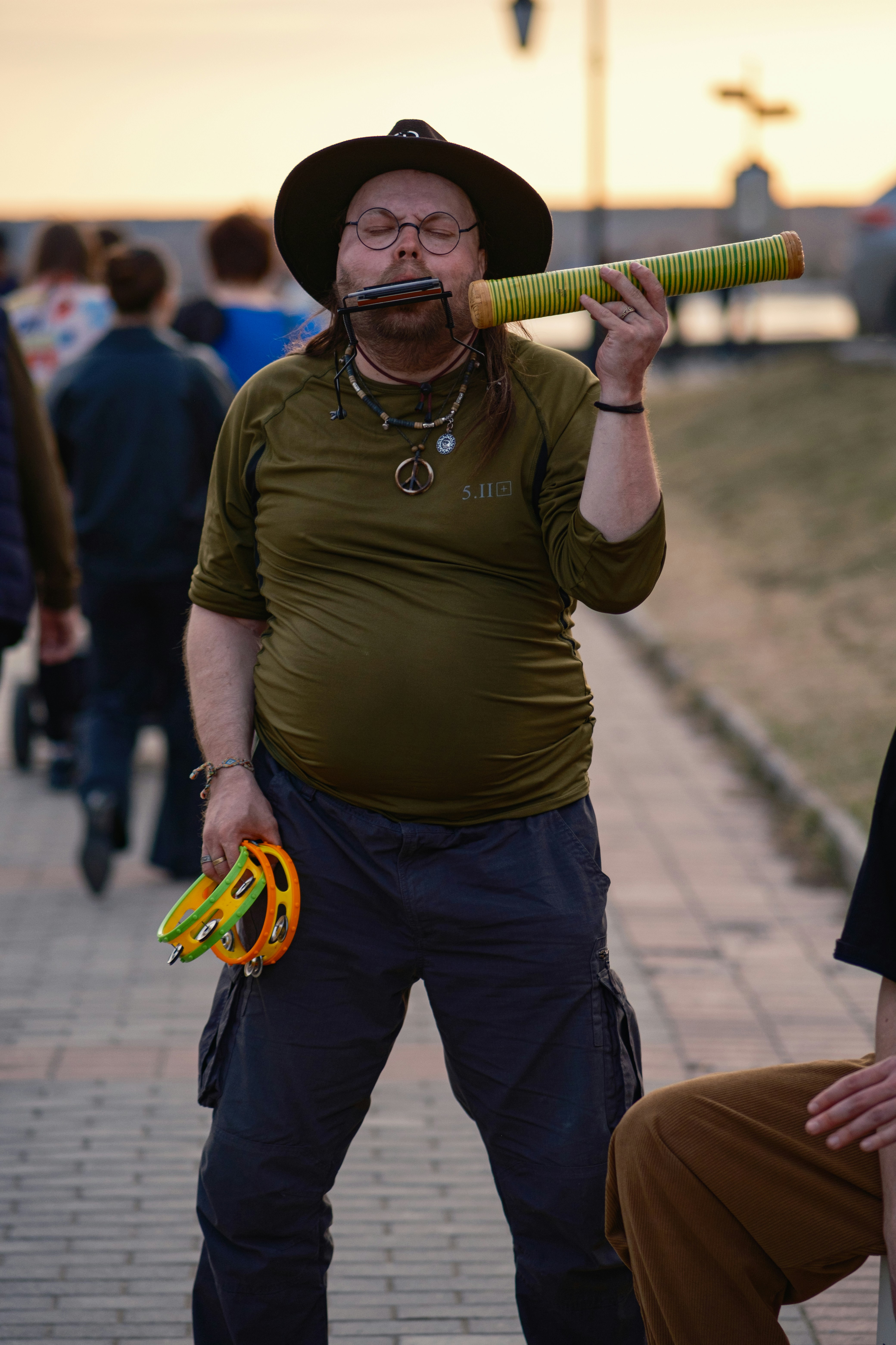Harmonica in the Sunset: Street Busker Blows a Tune