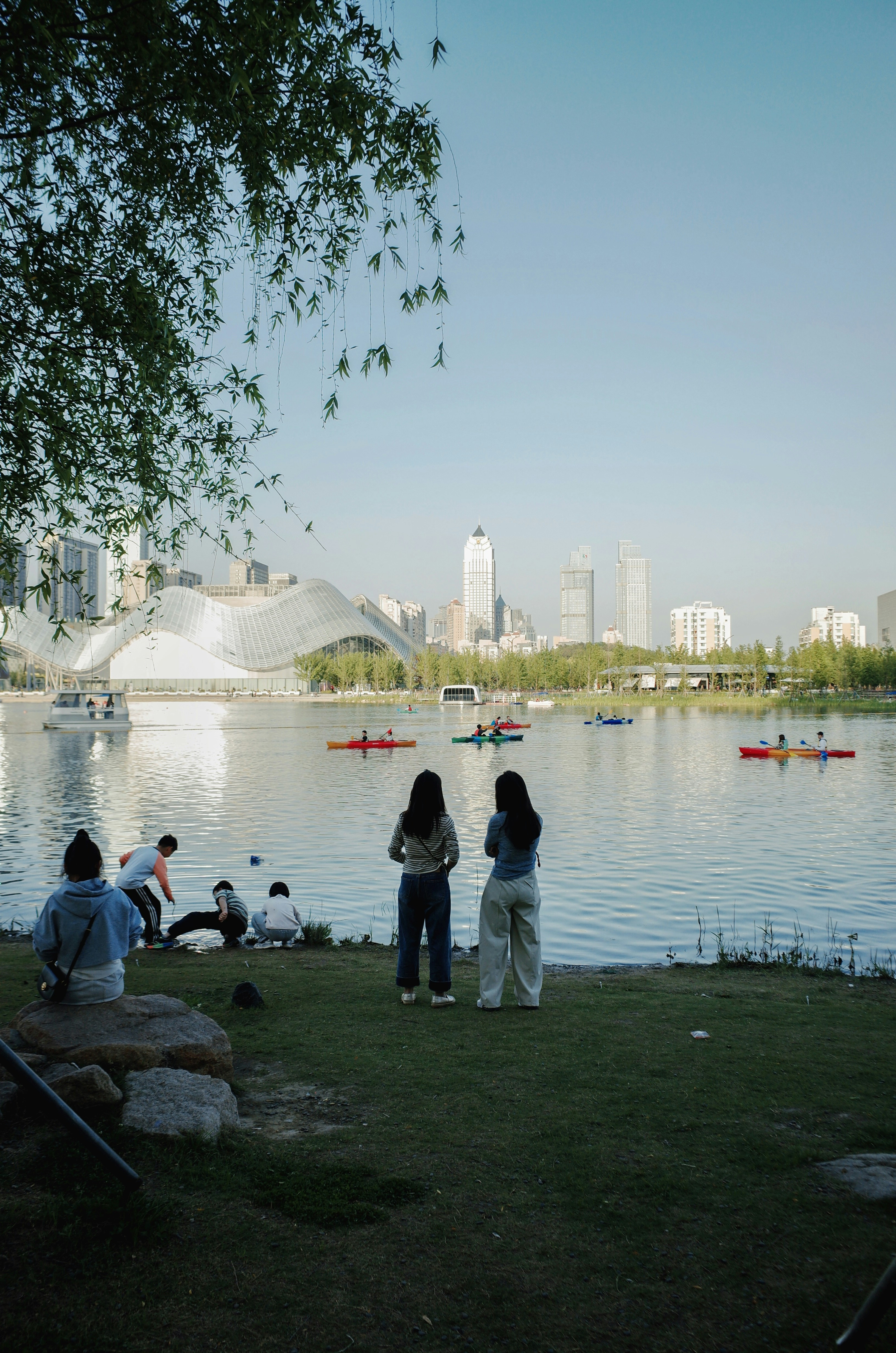 Evening by the River: Friends at the City Park